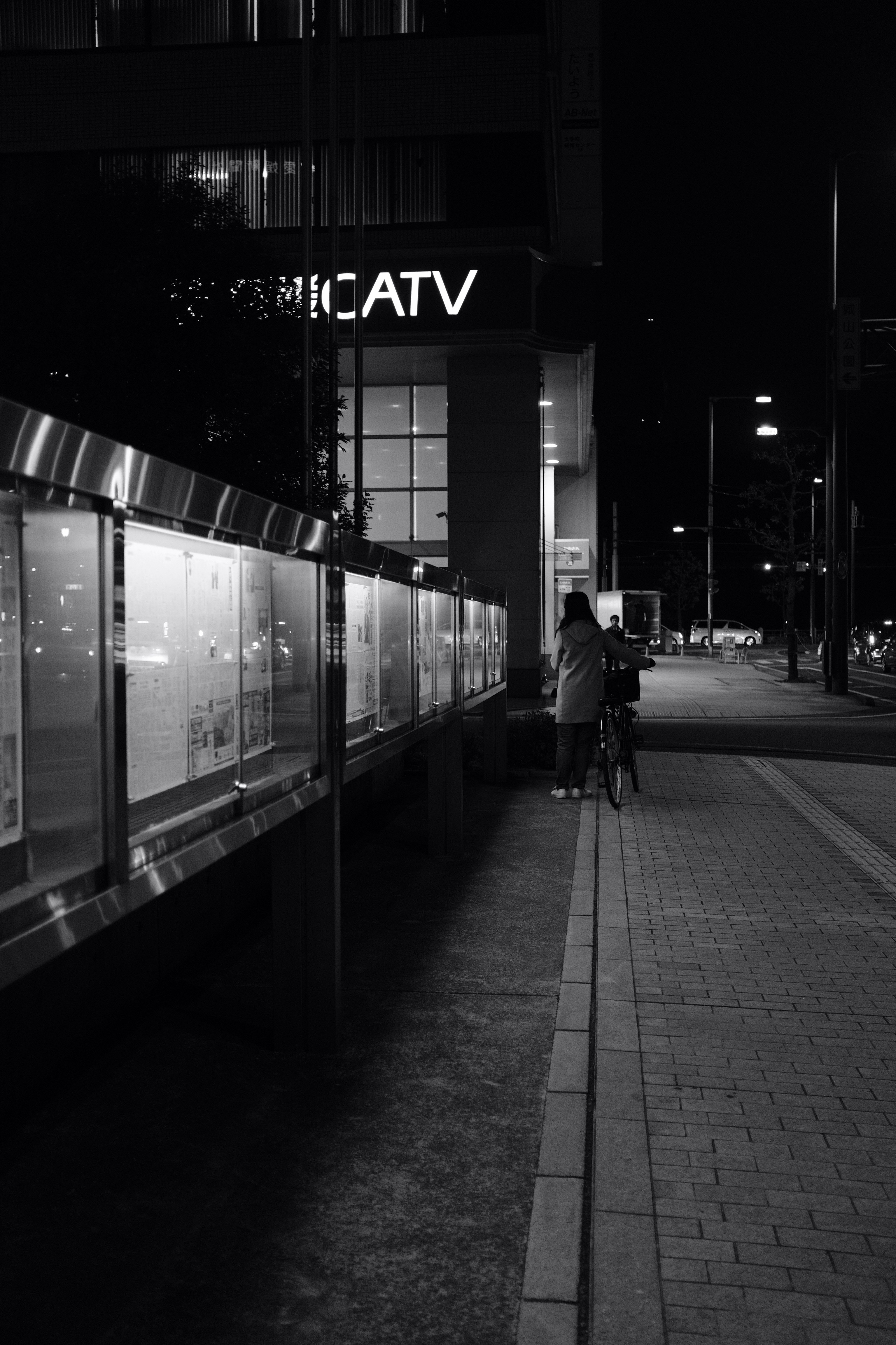 Woman holding bicycle standing beside the building photo – Free ...