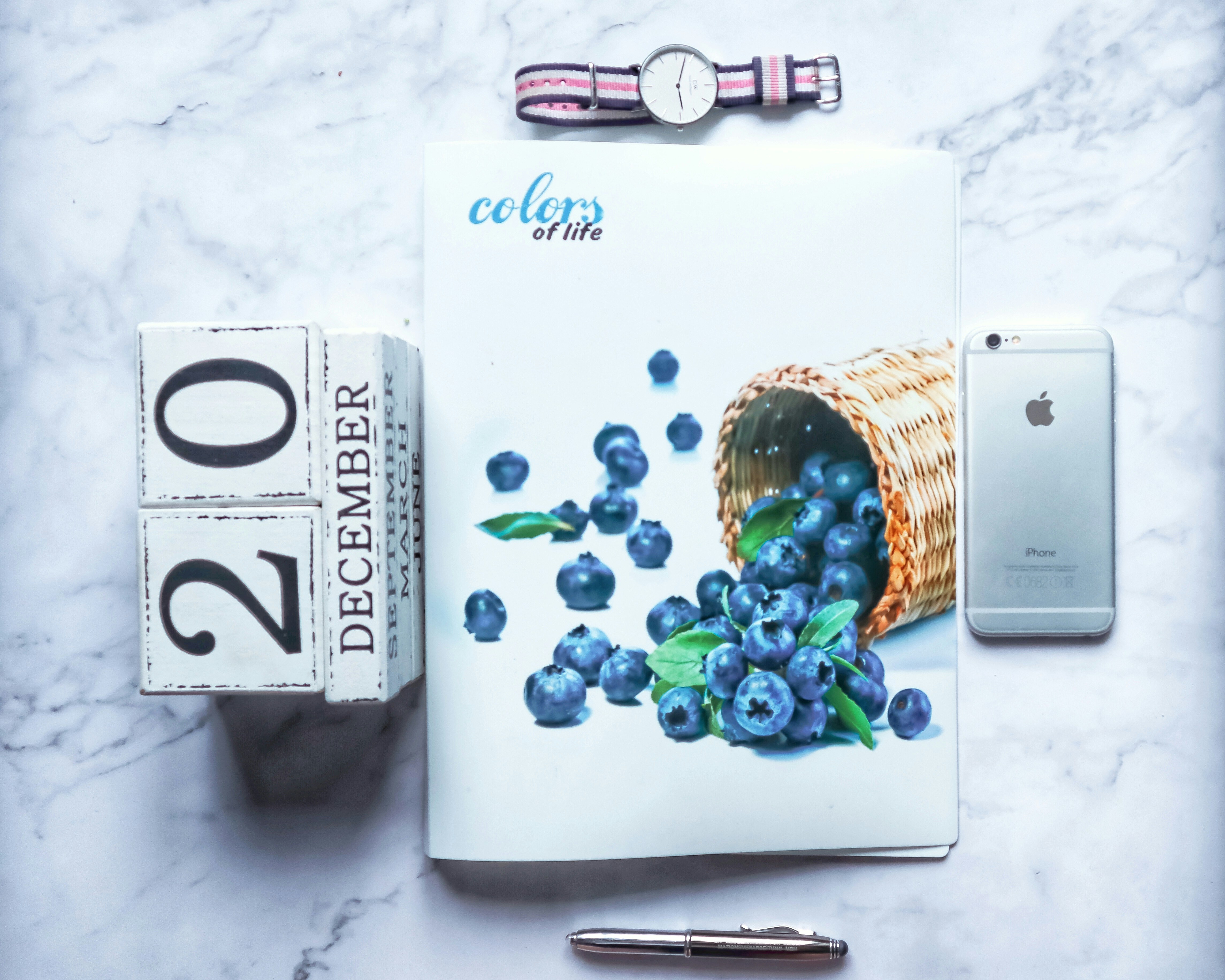 Blueberry Still Life: A Marble Surface Gallery of Colorful Berries and Objects