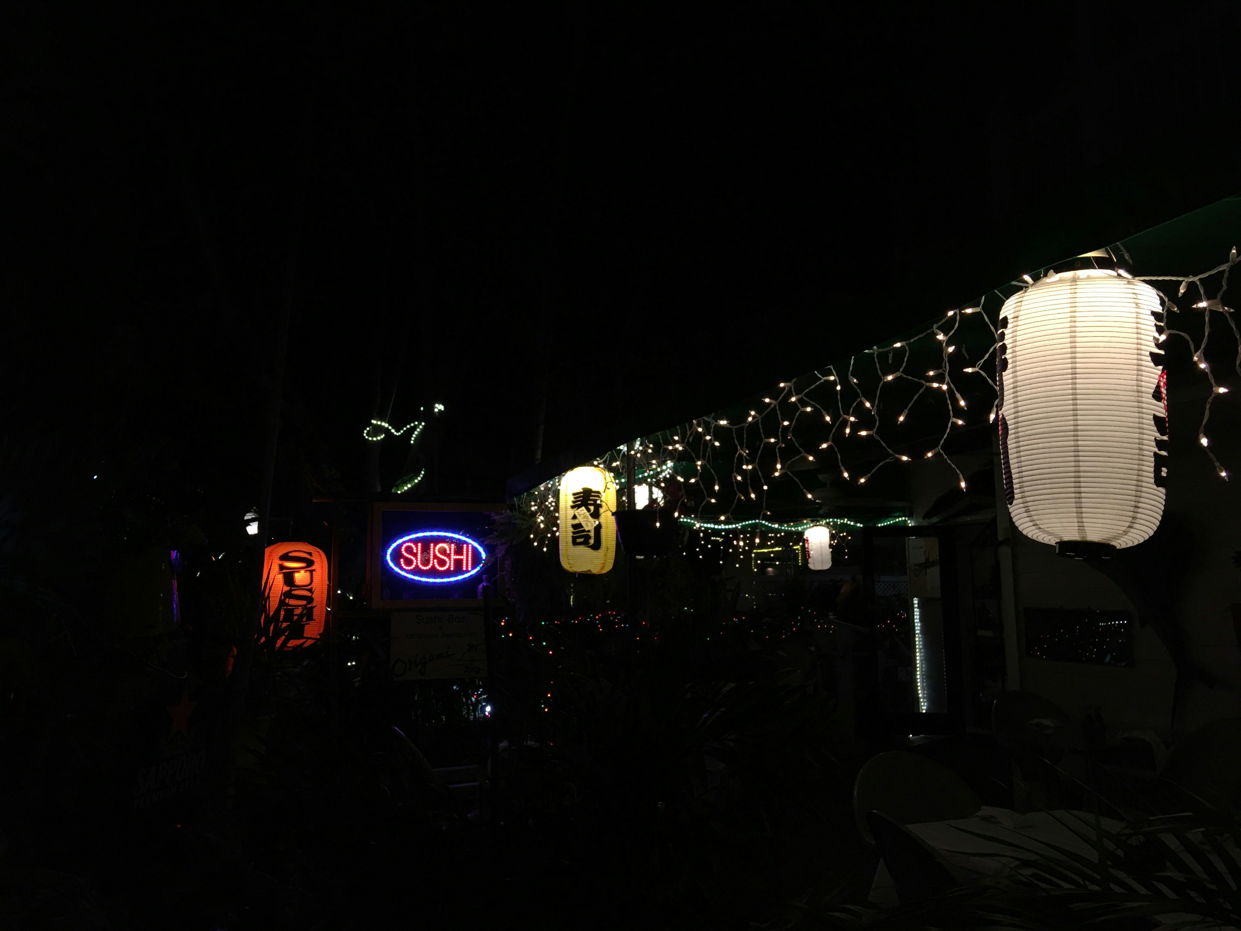 a dark street with a lot of lights on it