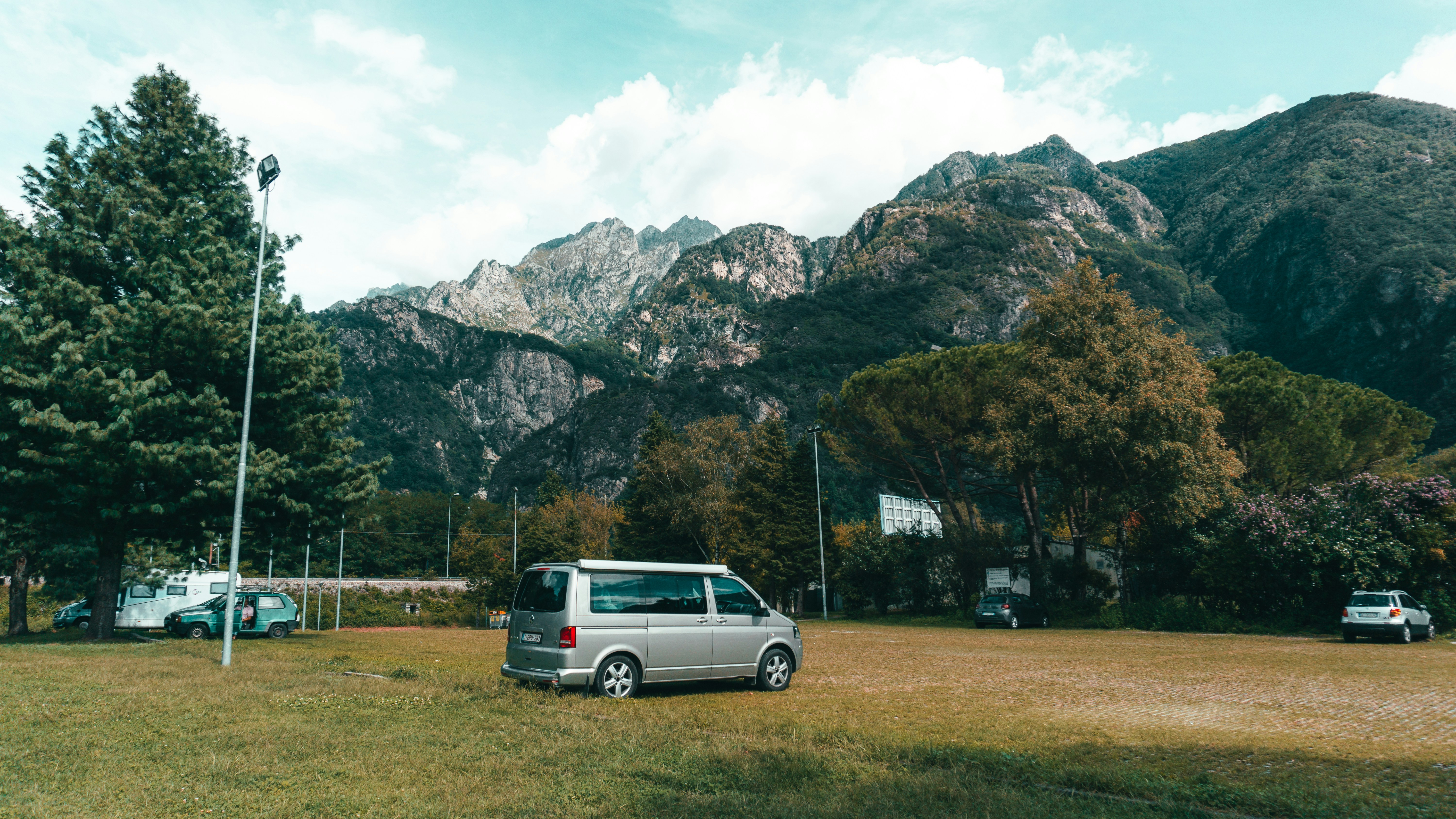 Vanished in the Valley: A Silver Minivan Amid Mountain Pines