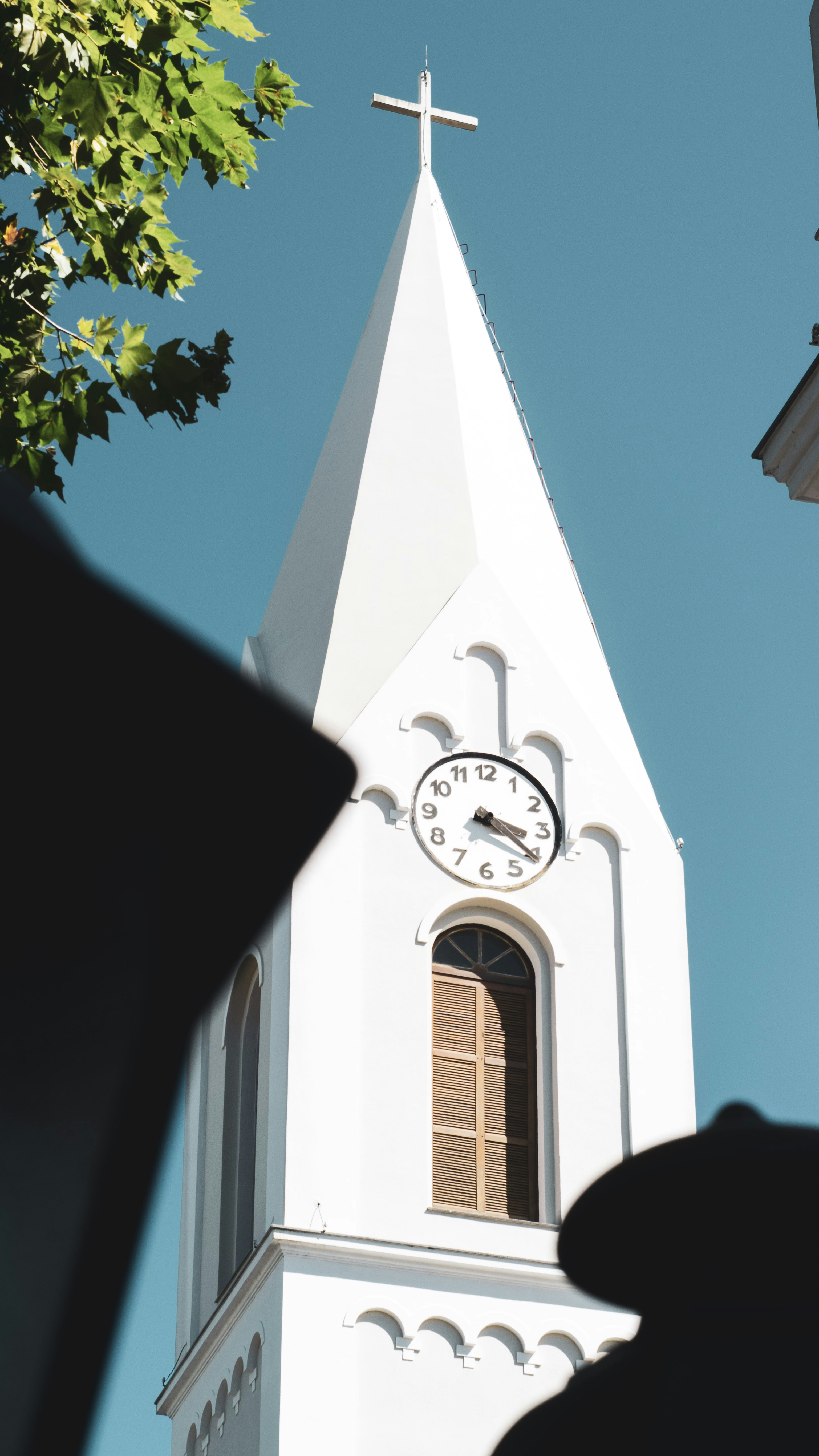 Clock Face on a White Spire Reaching Toward a Cerulean Afternoon