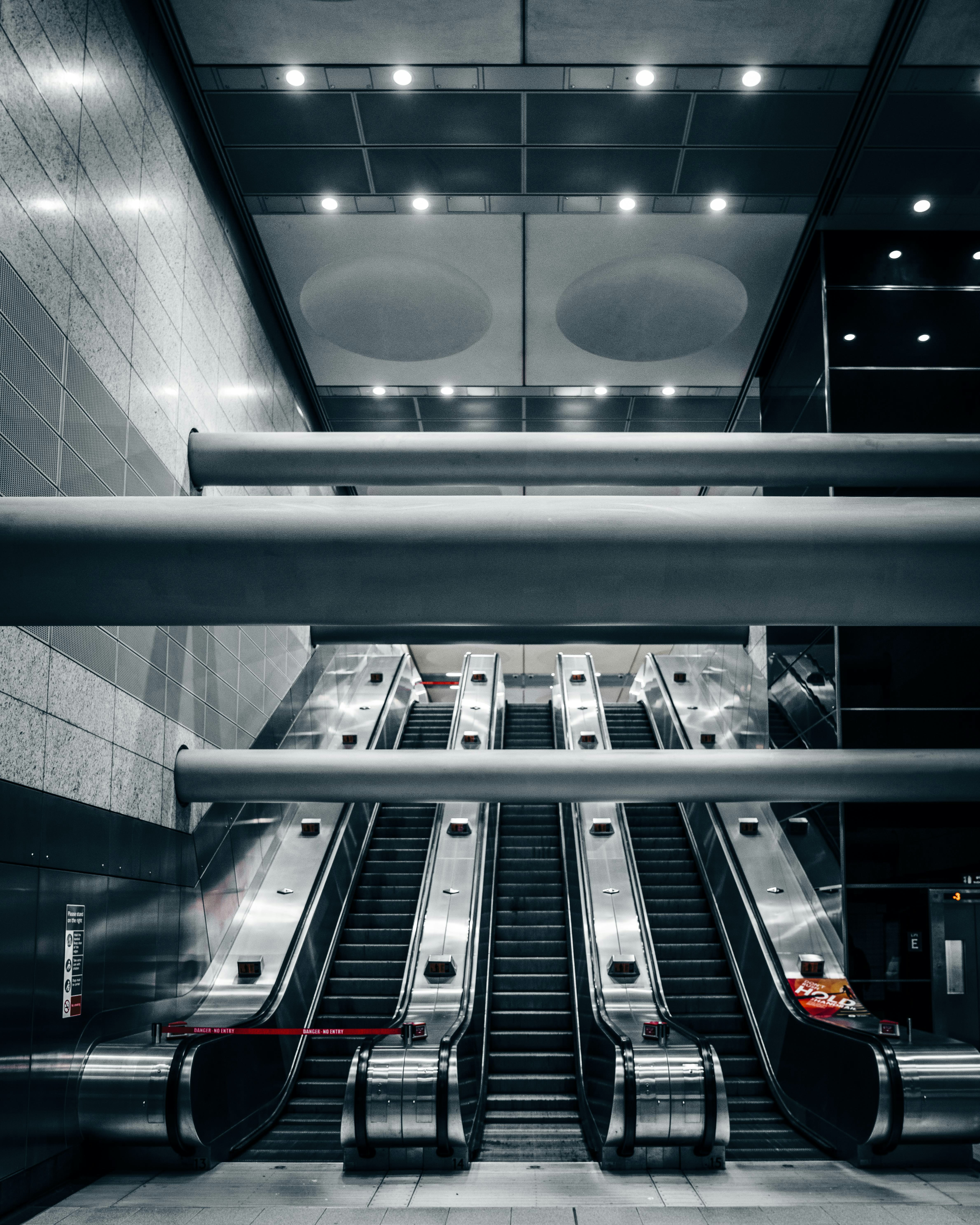Three escalators inside building photo – Free London Image on Unsplash