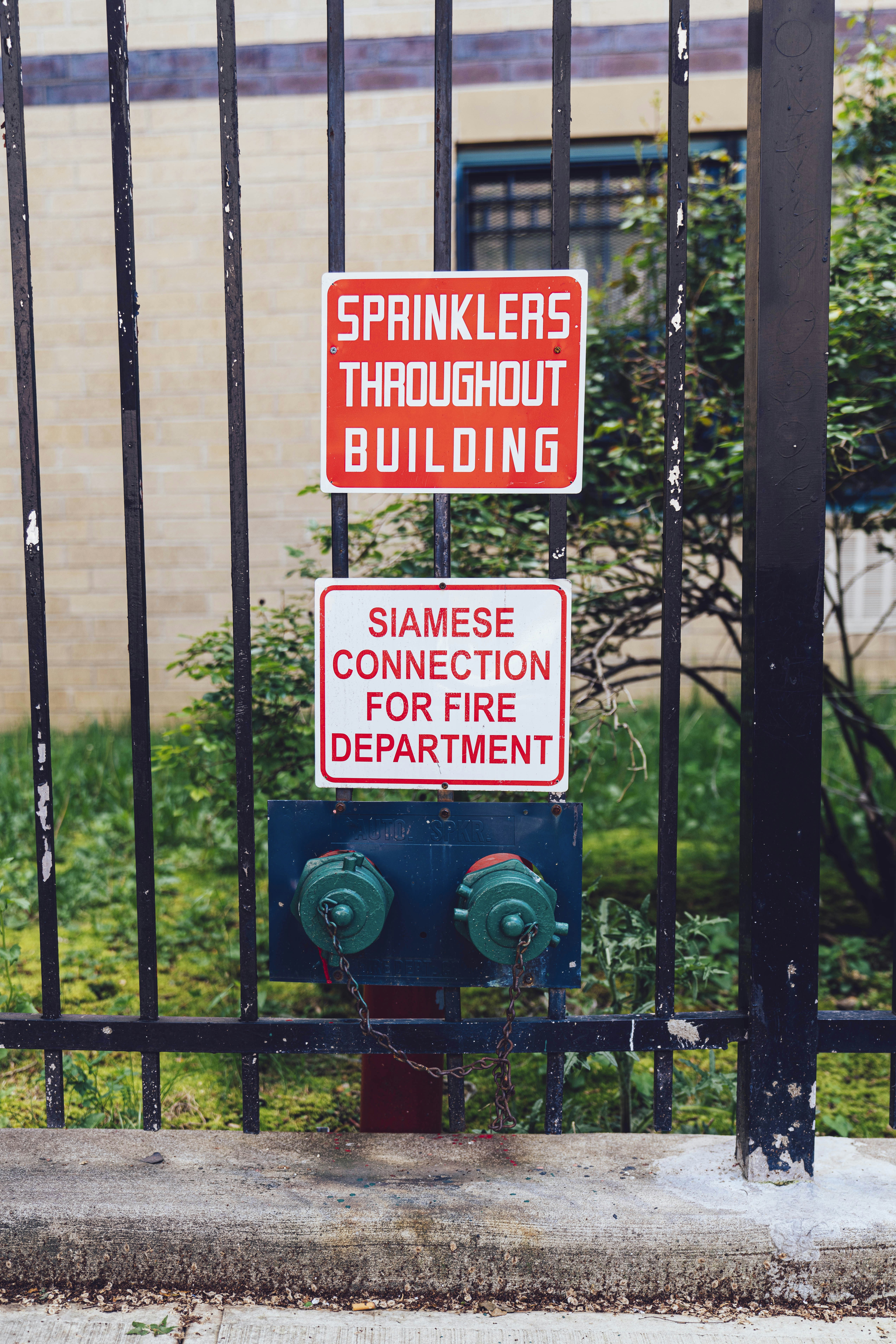 Sprinklers throughout building fence sign photo – Free Bushwick Image ...