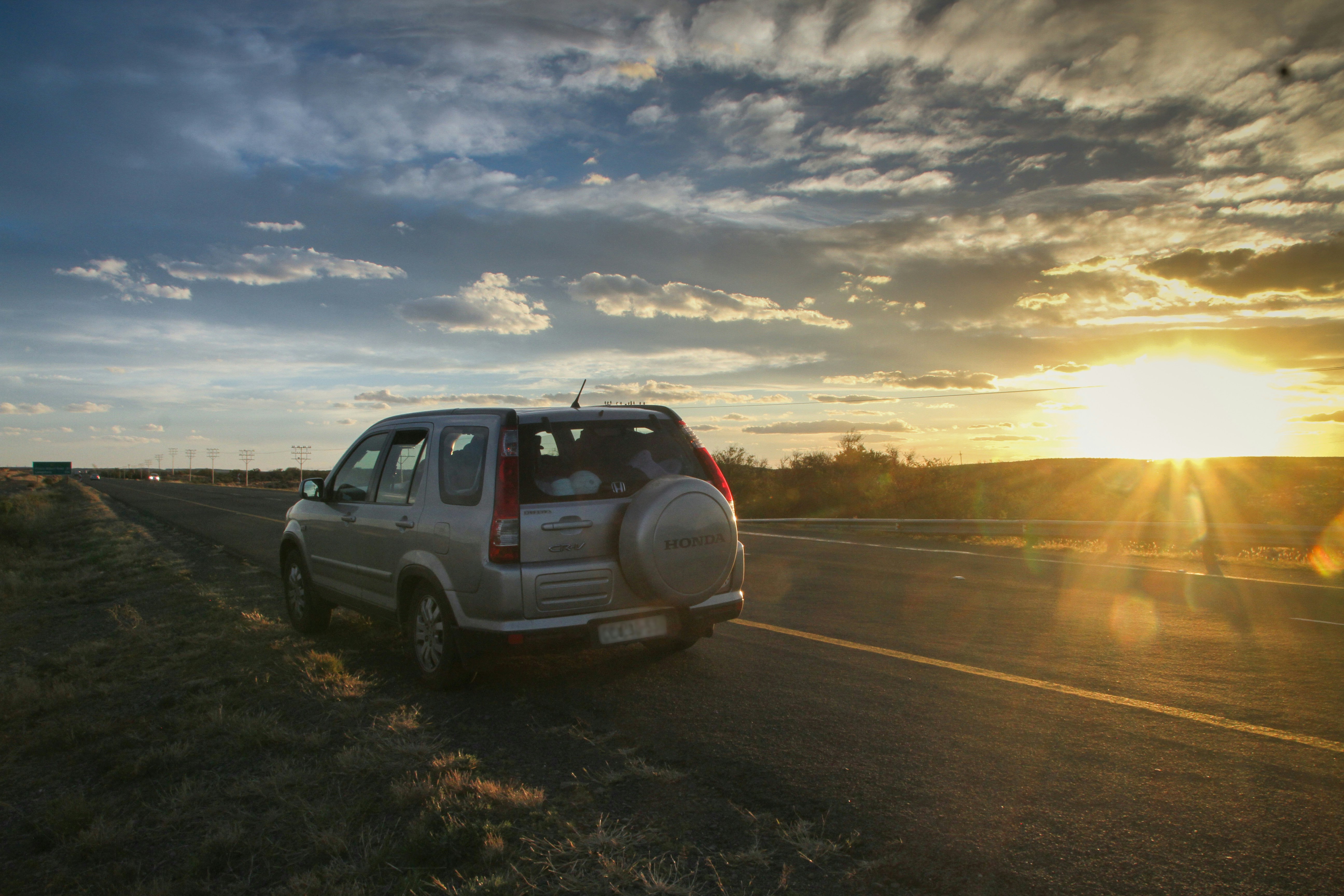 SUV on a country road.  | parked SUV
