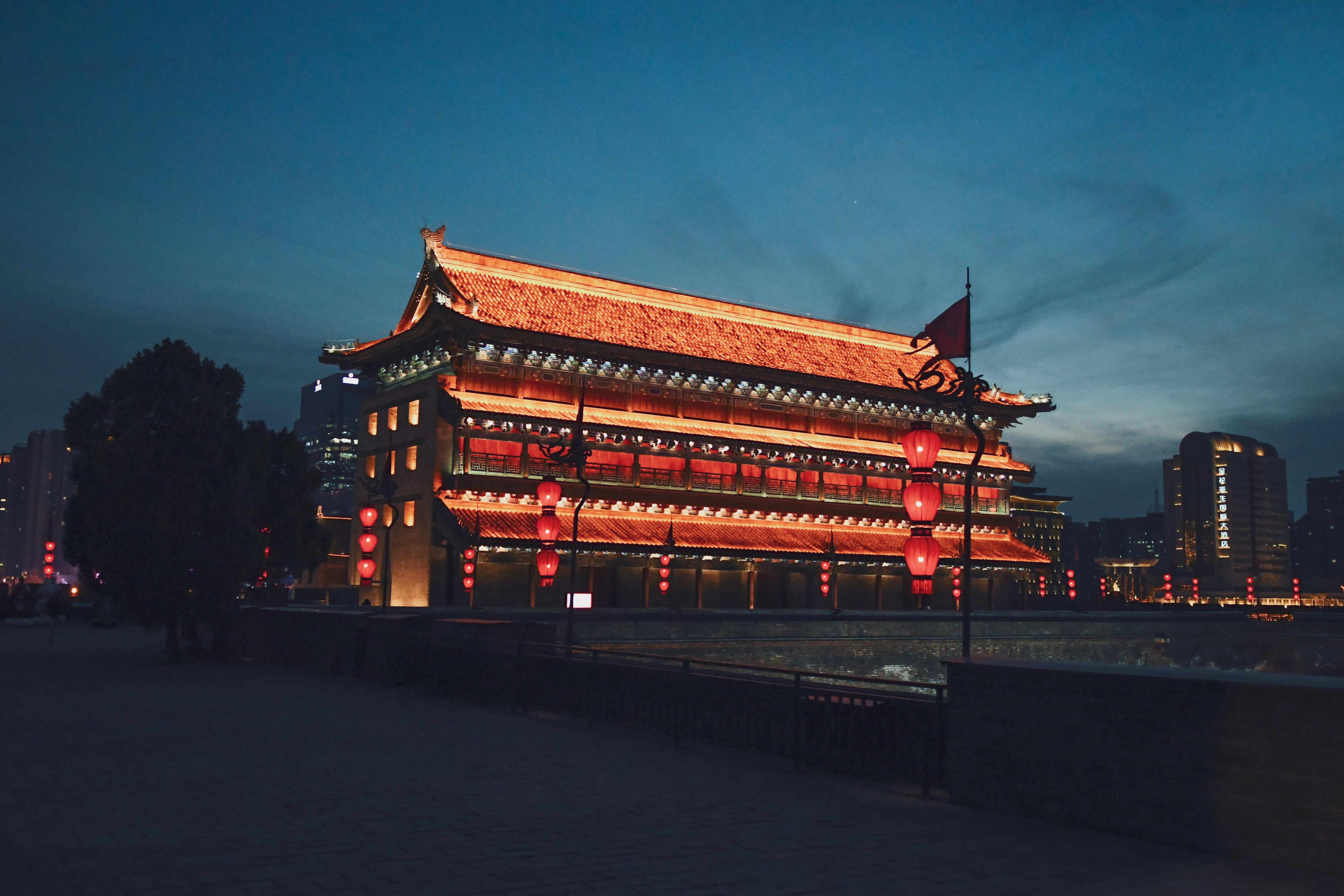 Lantern-lit Riverside Pavilion at Dusk