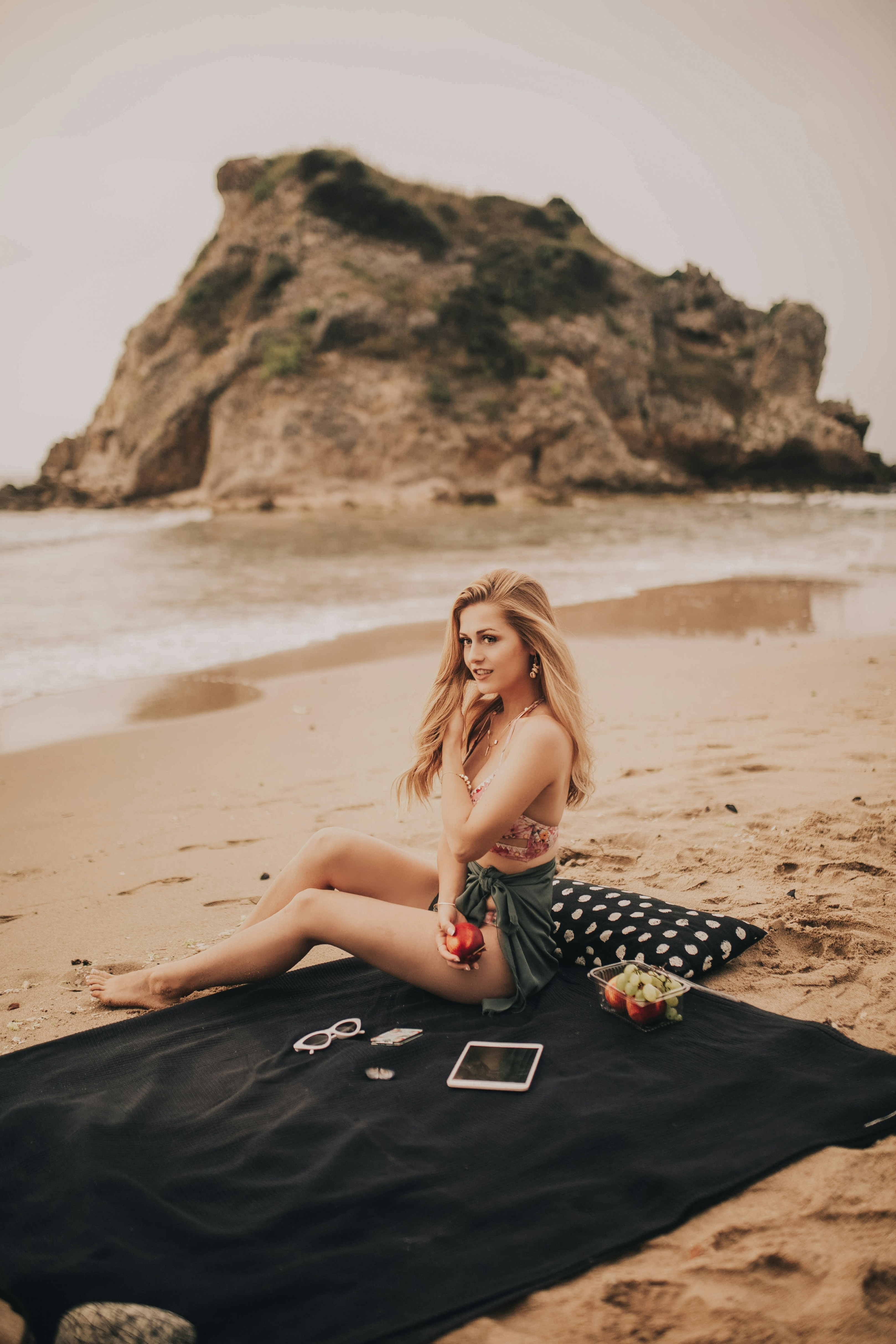 Coastal Quiet: Portrait on a Blanket Beside a Cliff Island