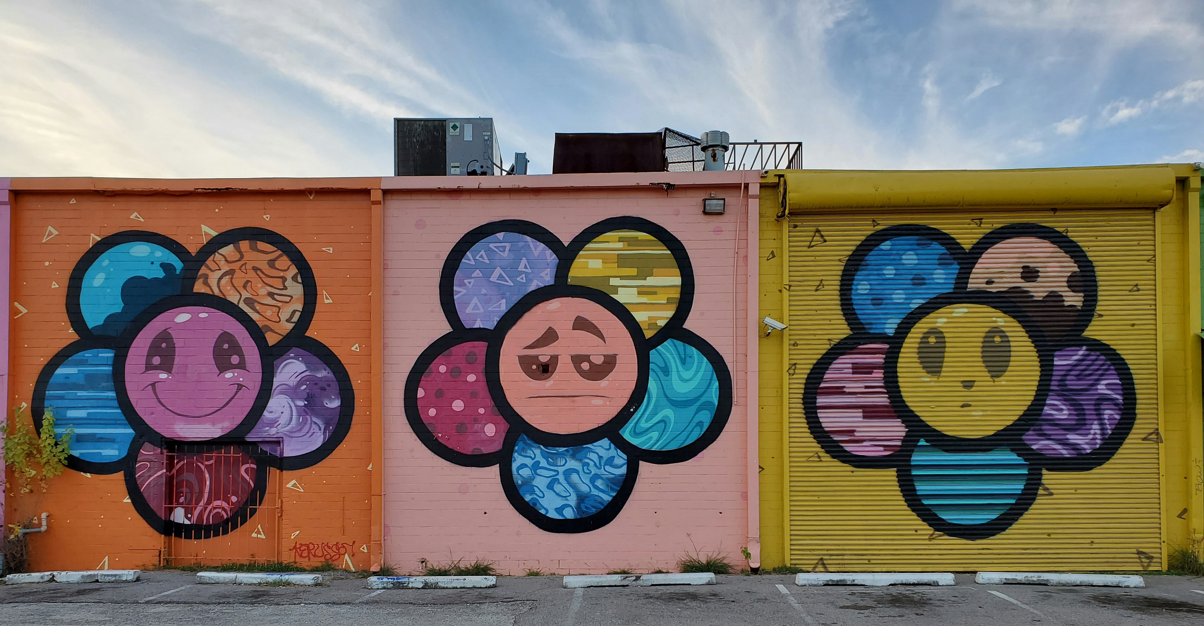 Three-Panel Flower Murals on Weathered Cargo Containers