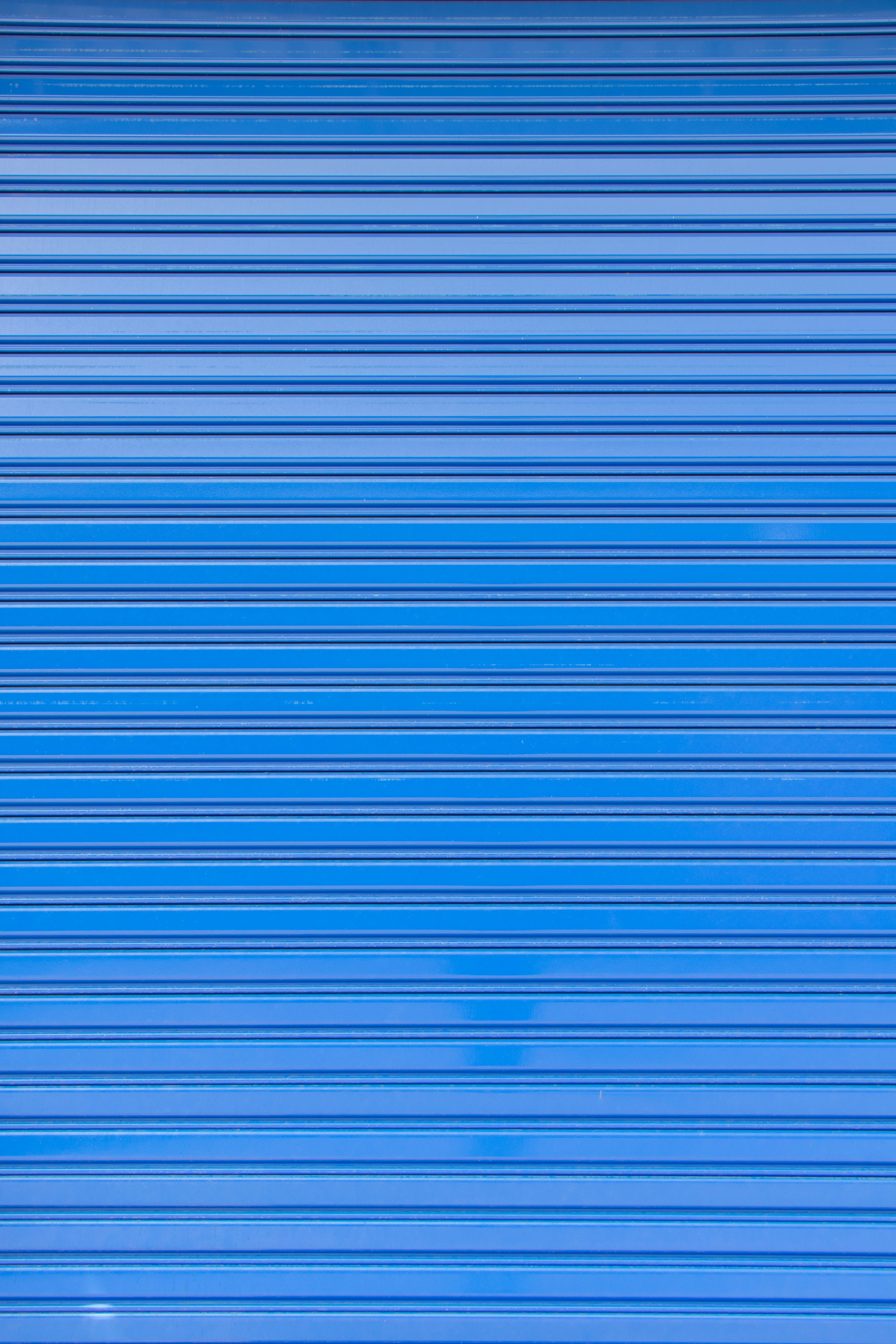 A blue garage door with a stop sign in front of it photo – Free Blue ...