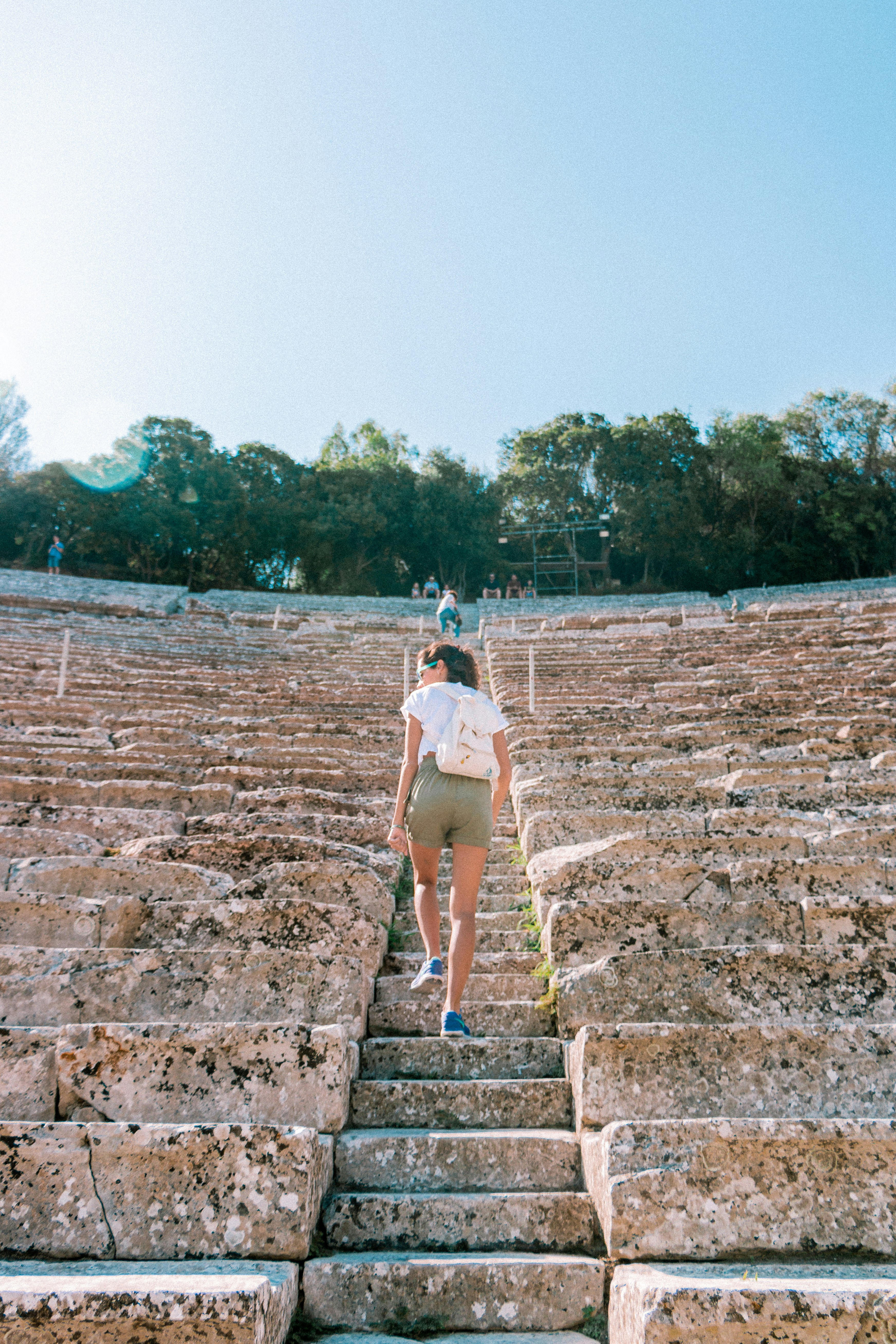 ascent through ancient stone tiers toward the sunlit summit