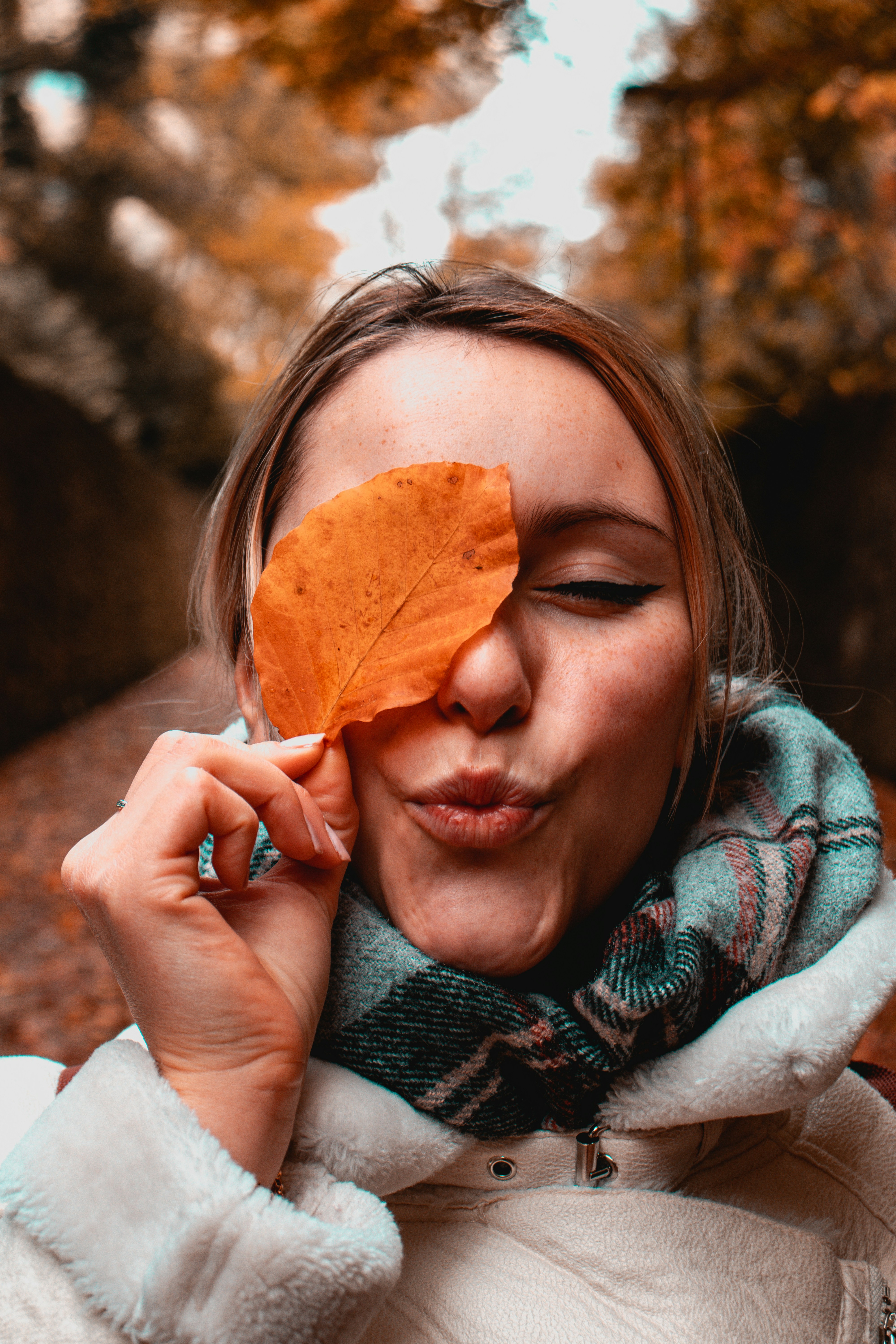Autumn Mask: A Leaf Veil Over a Playful Smile