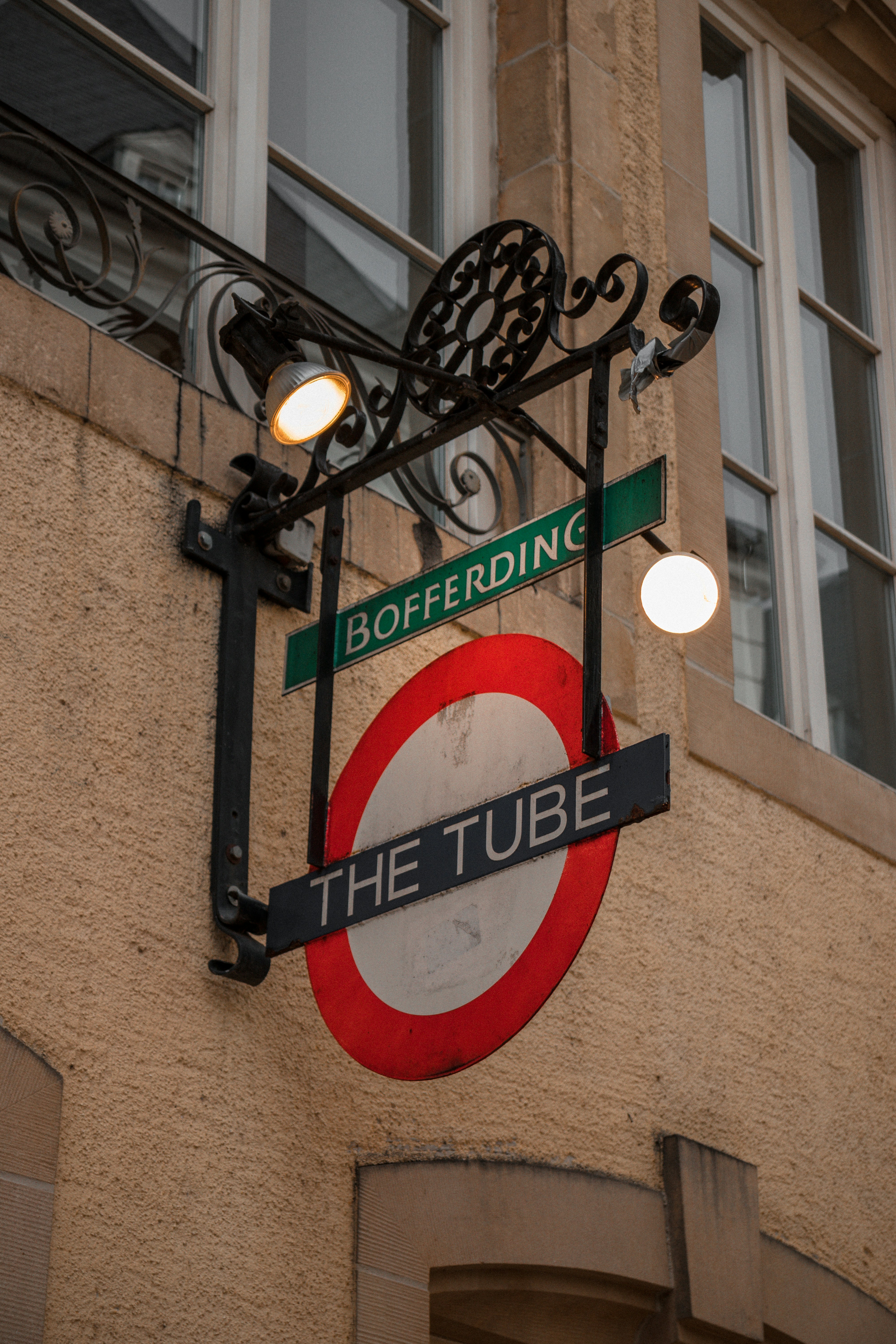 Ornate London Underground Sign Bathed in Lantern Light