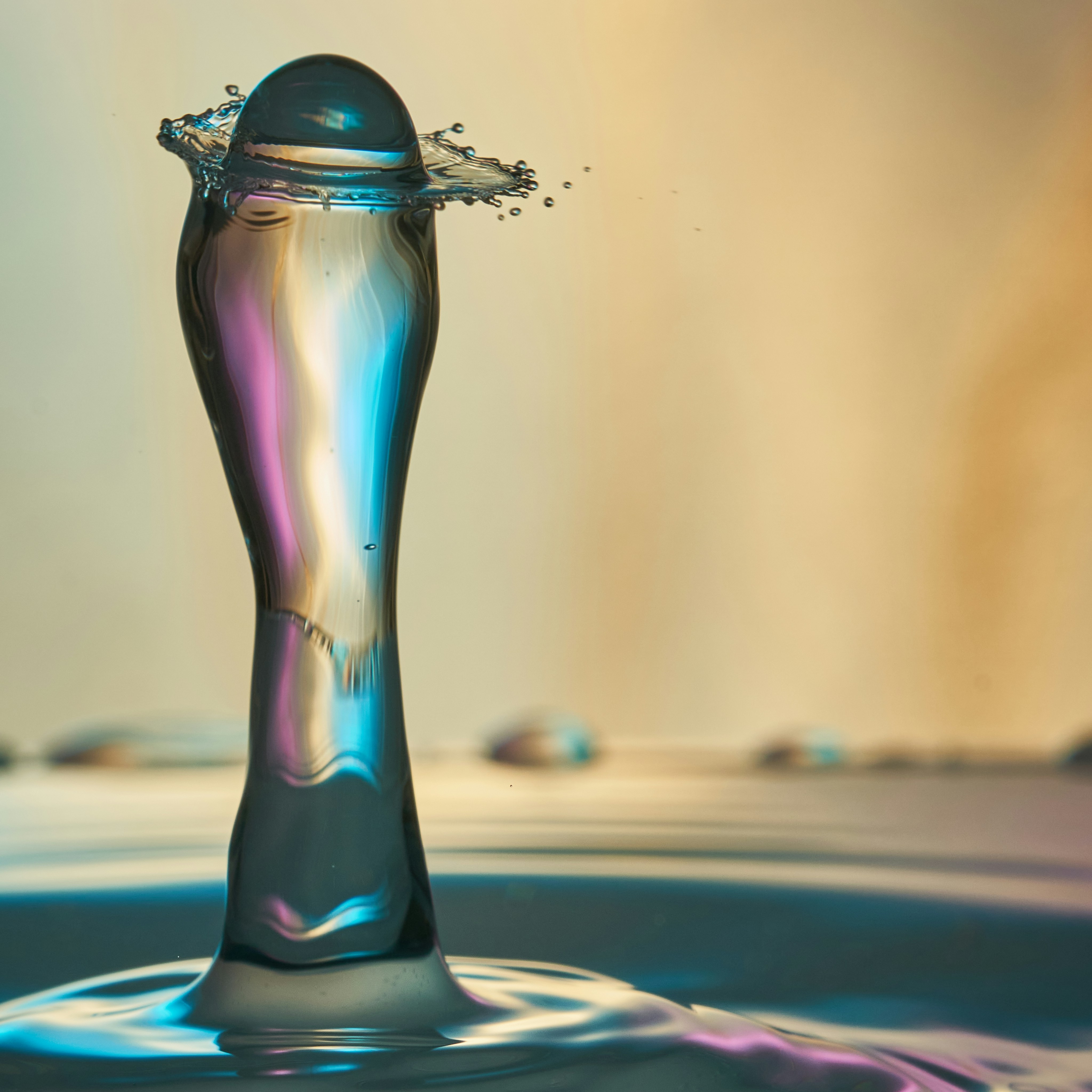 Prismatic Water Column: Rainbow Refractions Rising from a Quiet Pool
