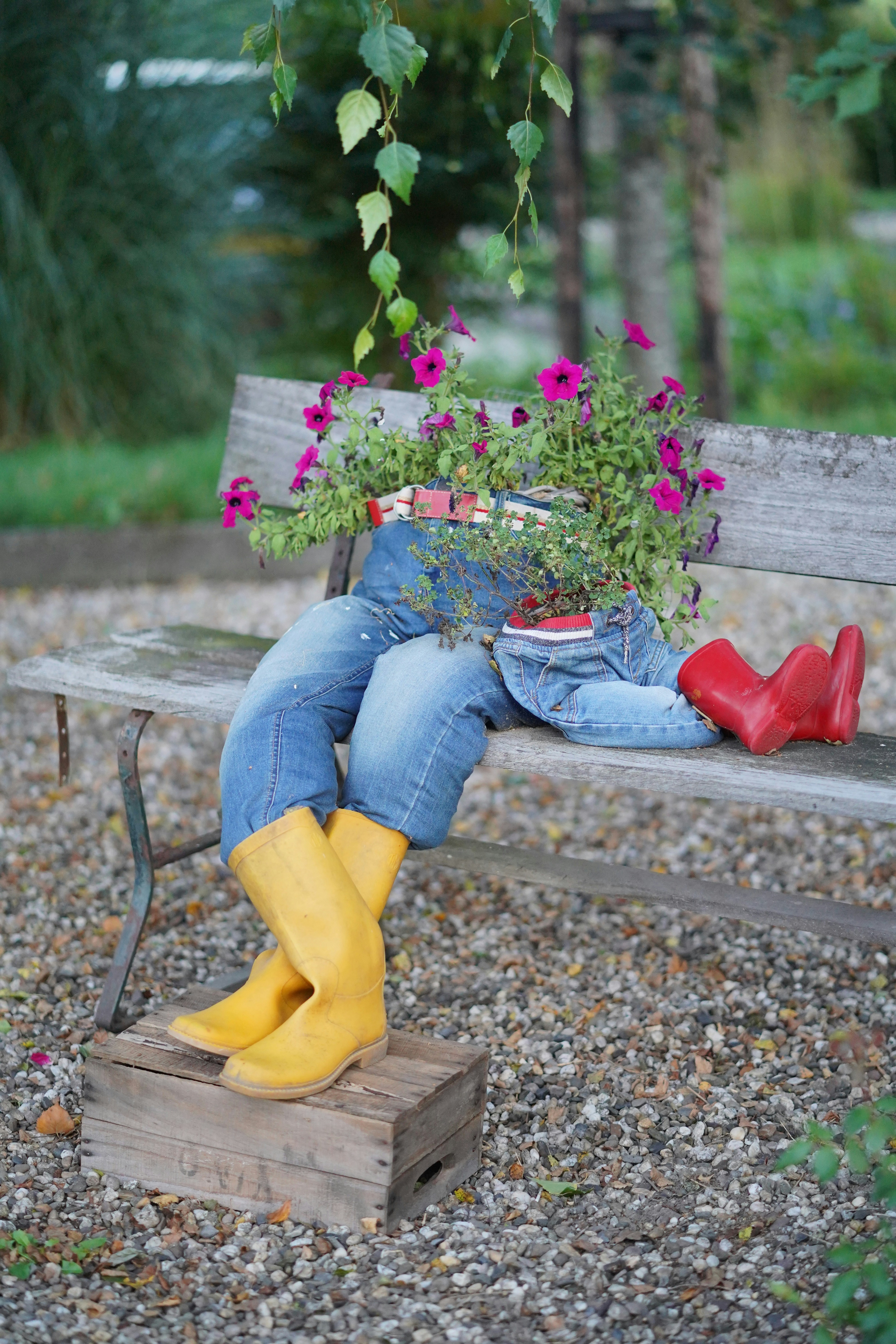 Creative work of pants with flowers sitting on bench