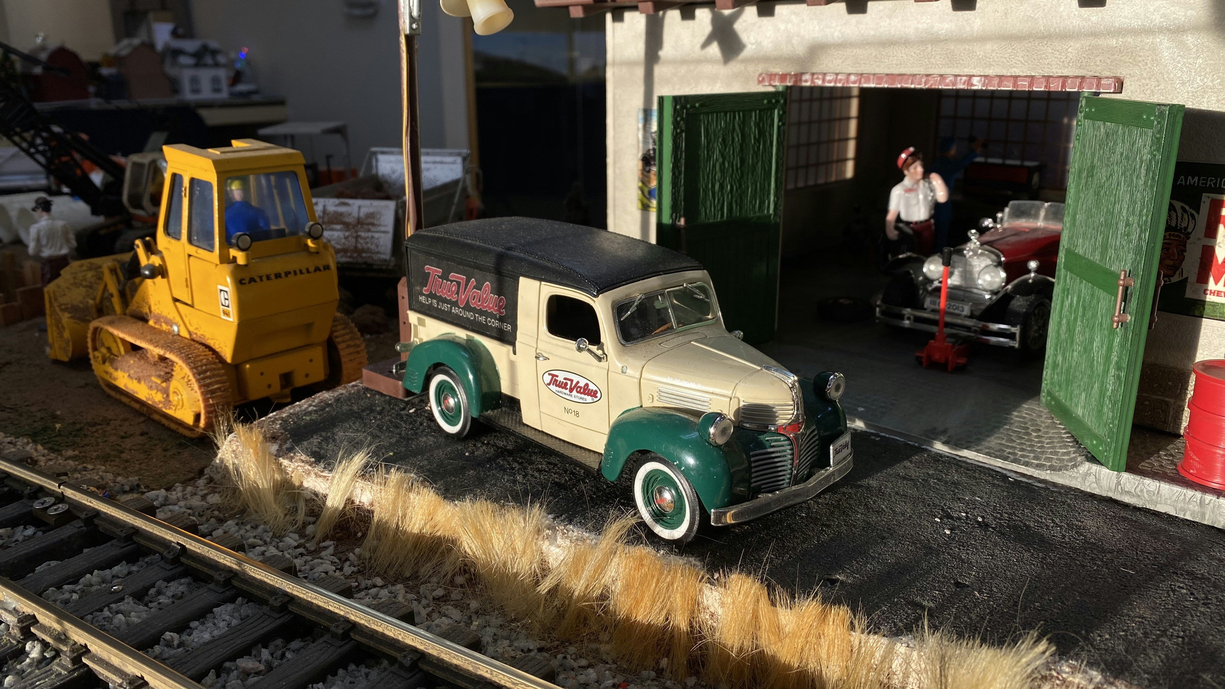 beige, black, and green vintage toy vehicle
