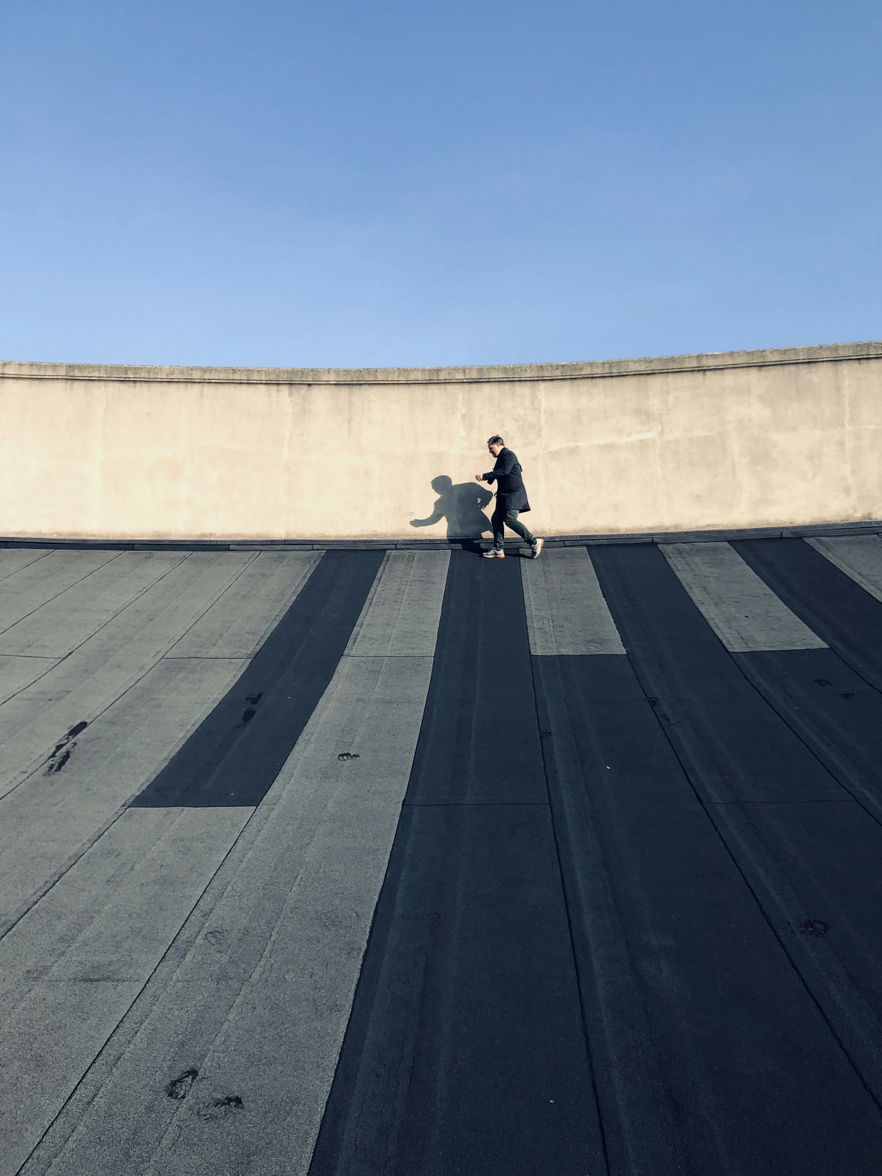 The account holder is seen diligently promenading on top of the very steep 180 degree curve of the car test track on the old FIAT car factory in the Lingotto district of Turin, Italy. Shot by the one and only, and my wife Petra, kudos to her, also for choosing me. Slightly edited.