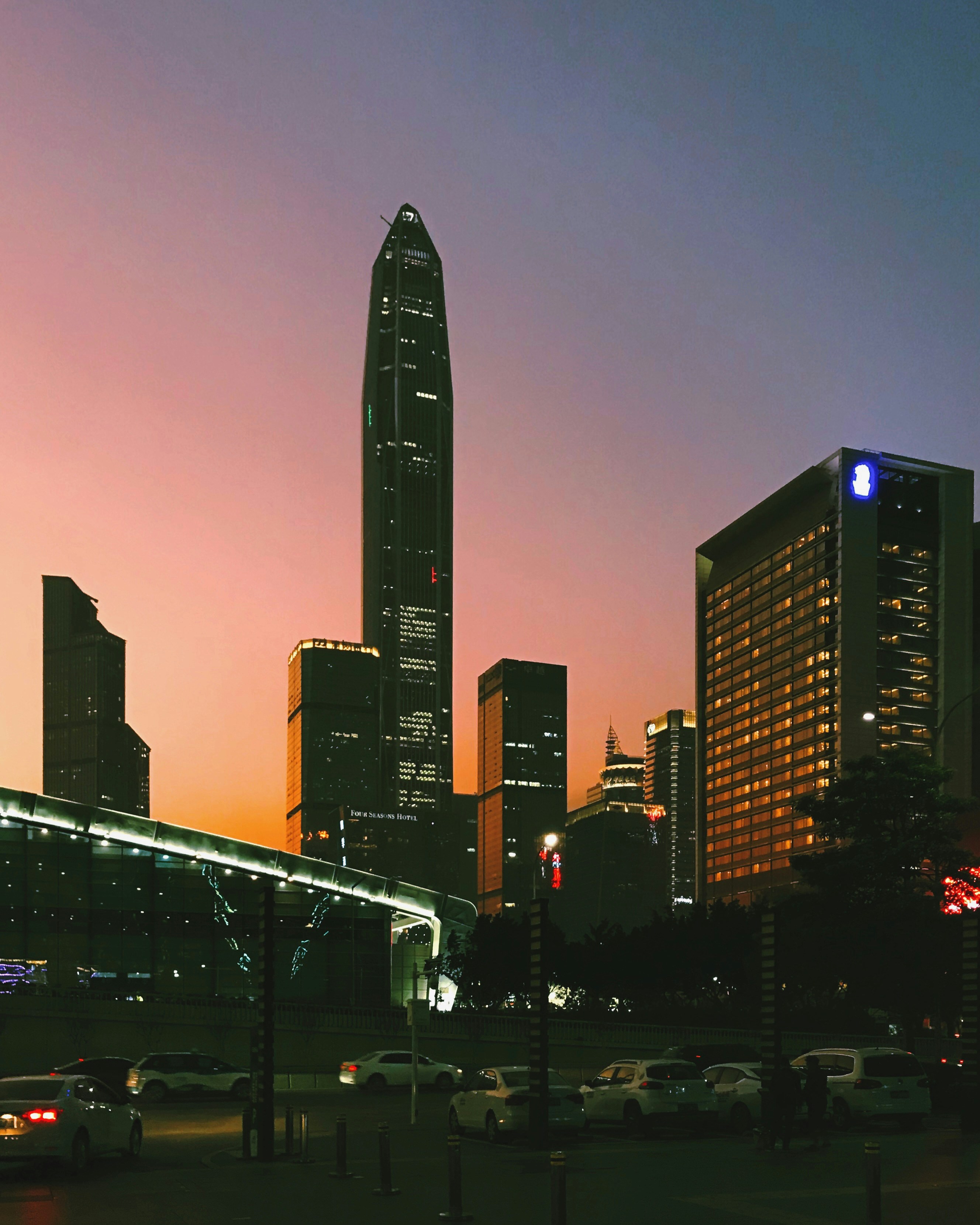 Crimson Dusk Over the Glass Spine of a Modern City