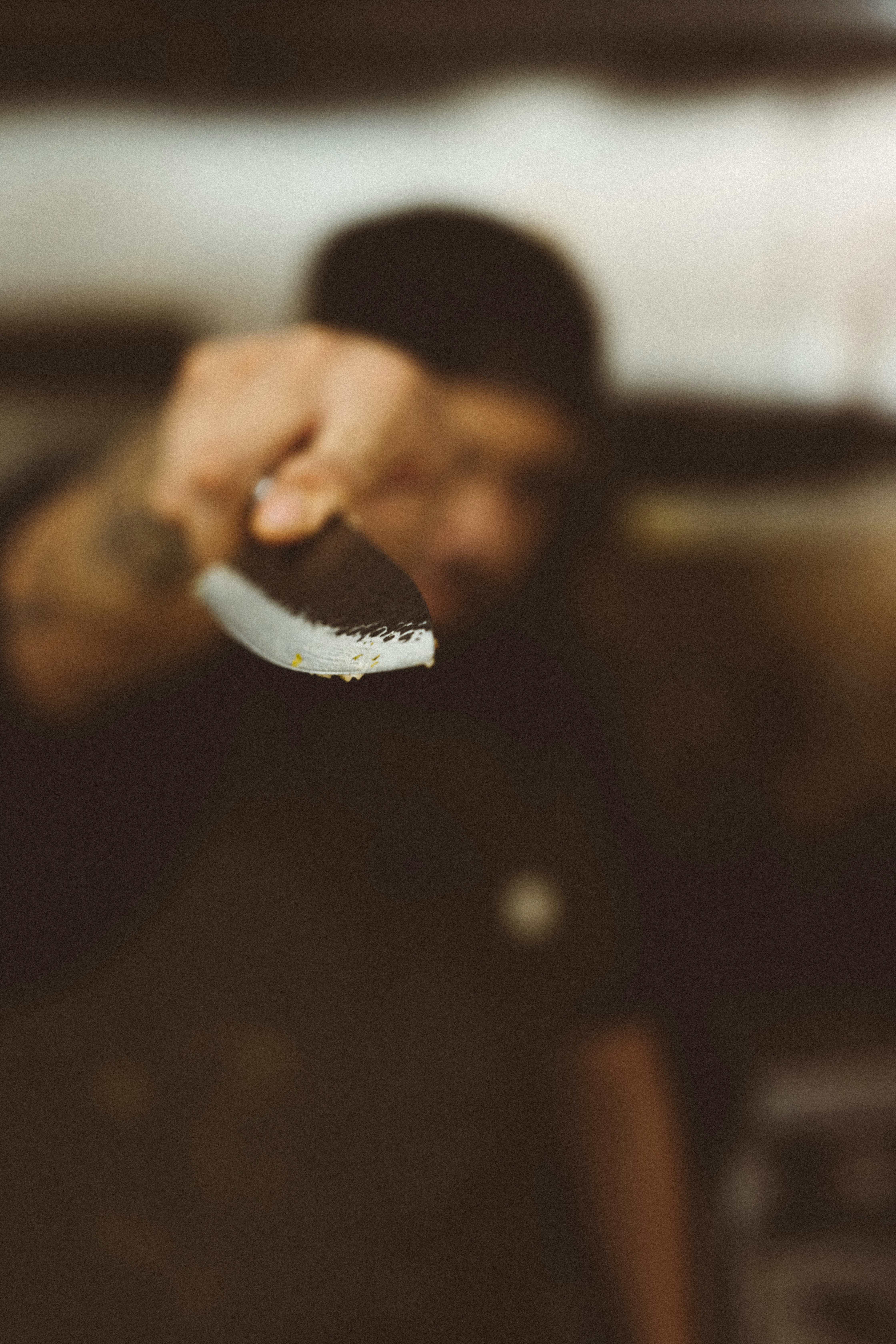The Hand-Conjured Slice: A Blurred Gesture Reaches Forward