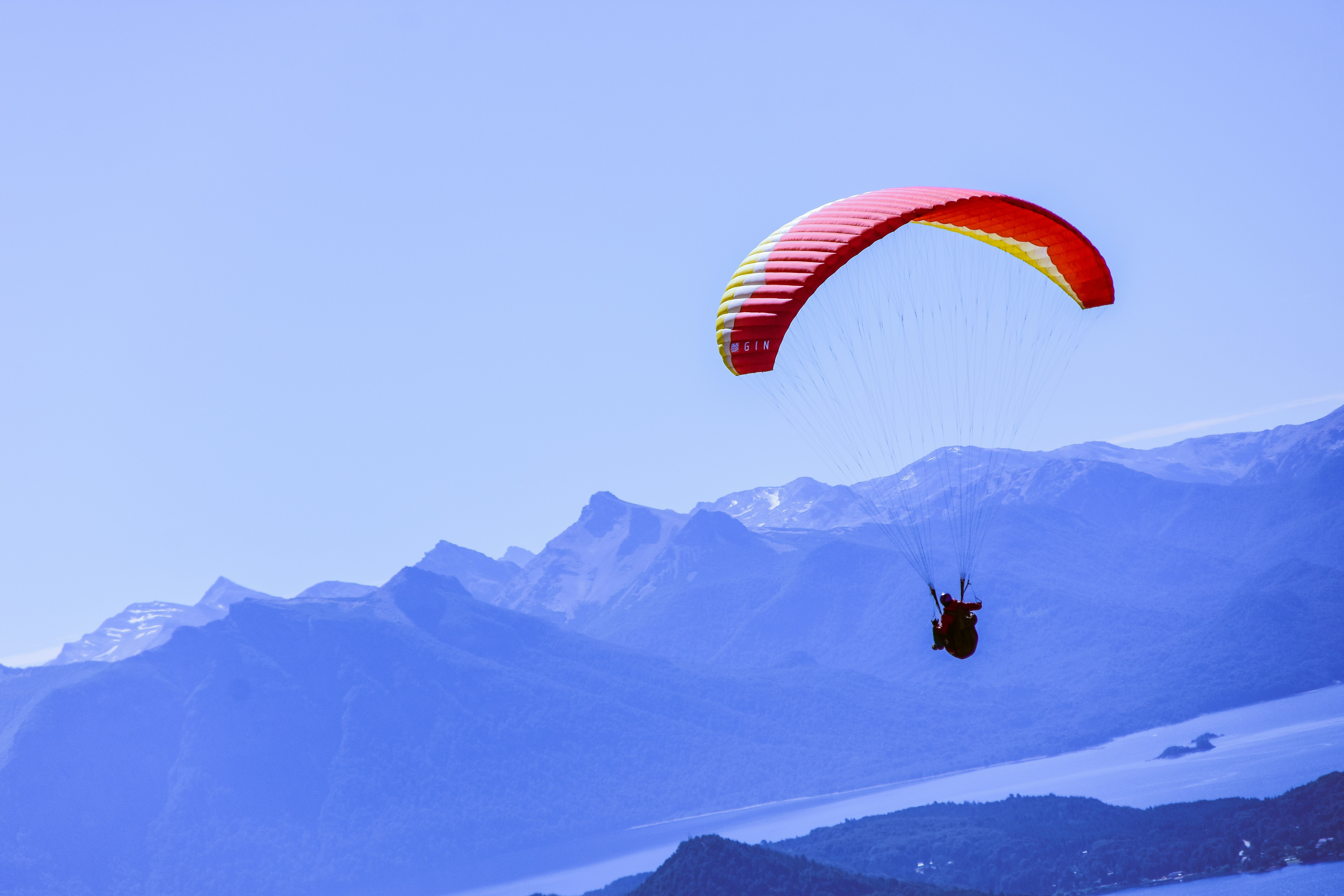 Person parachuting over mountains photo – Free Adventure Image on Unsplash