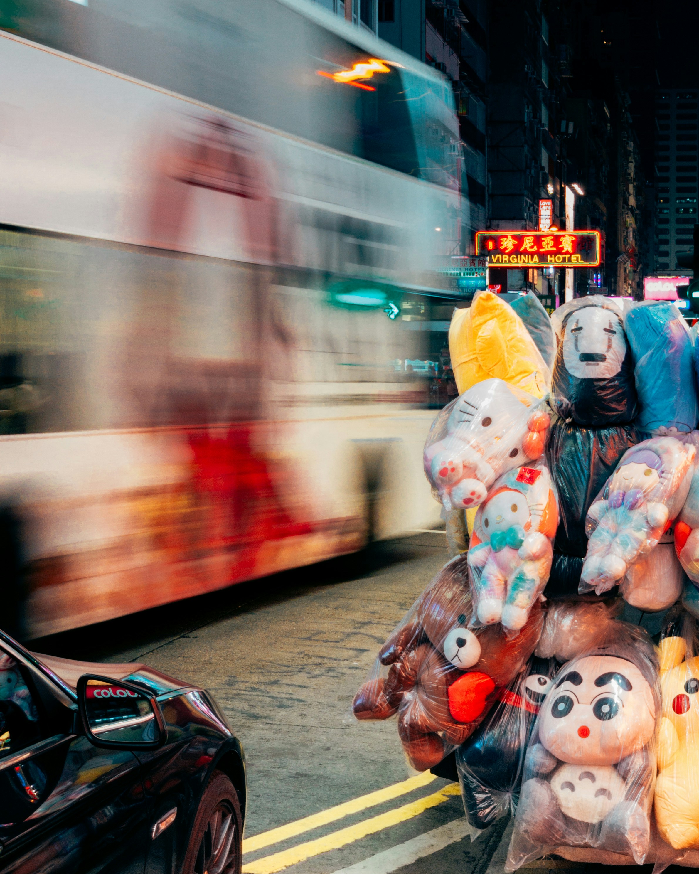 Colorful Bear Parade Amid Blurred City Transit