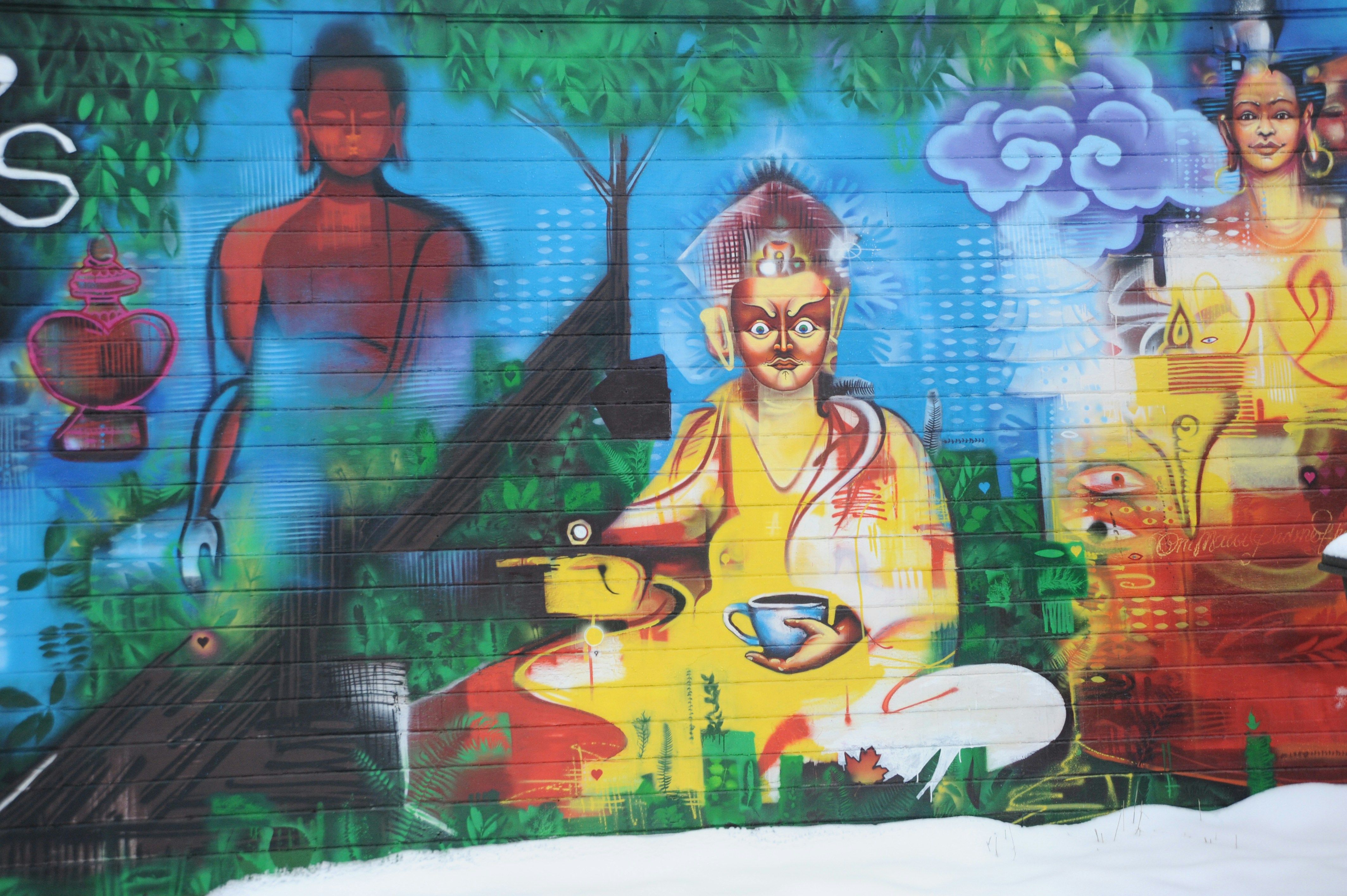 Graffiti Shrine: A Meditative Scene of Monk Figures in Vivid Street Art