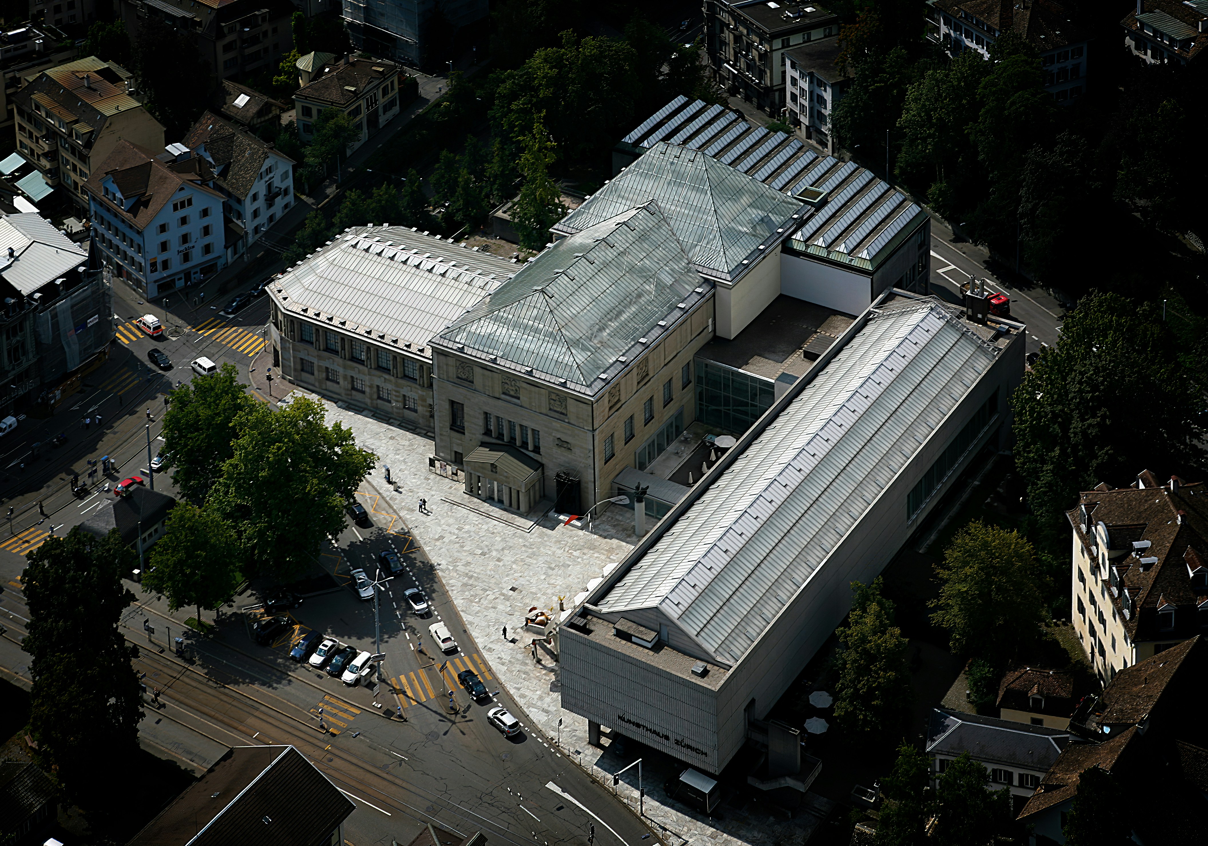 Aerial Glimmer: Glass Atrium at the Heart of a City Block