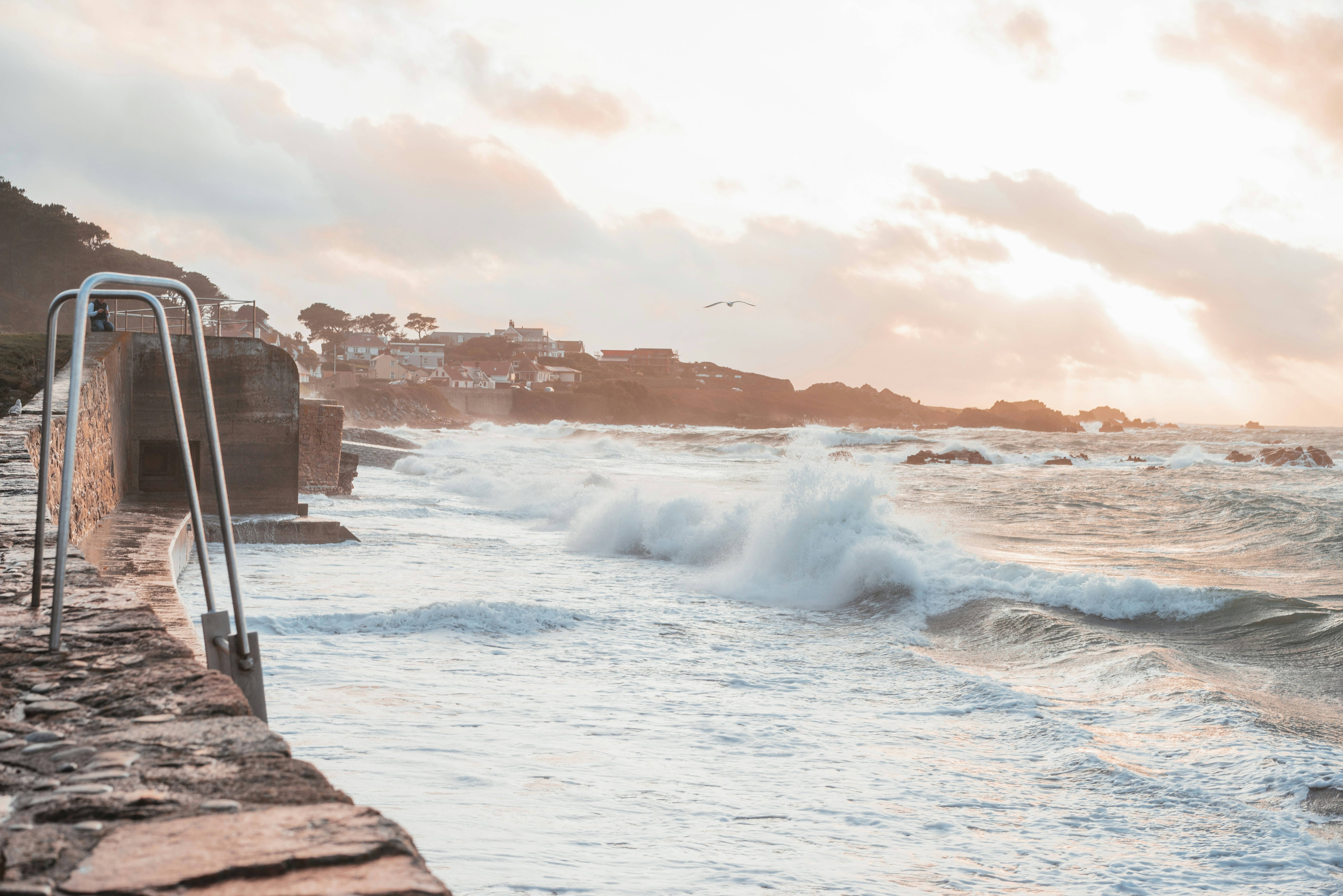 Sunlit Breakers by the Coastal Promenade