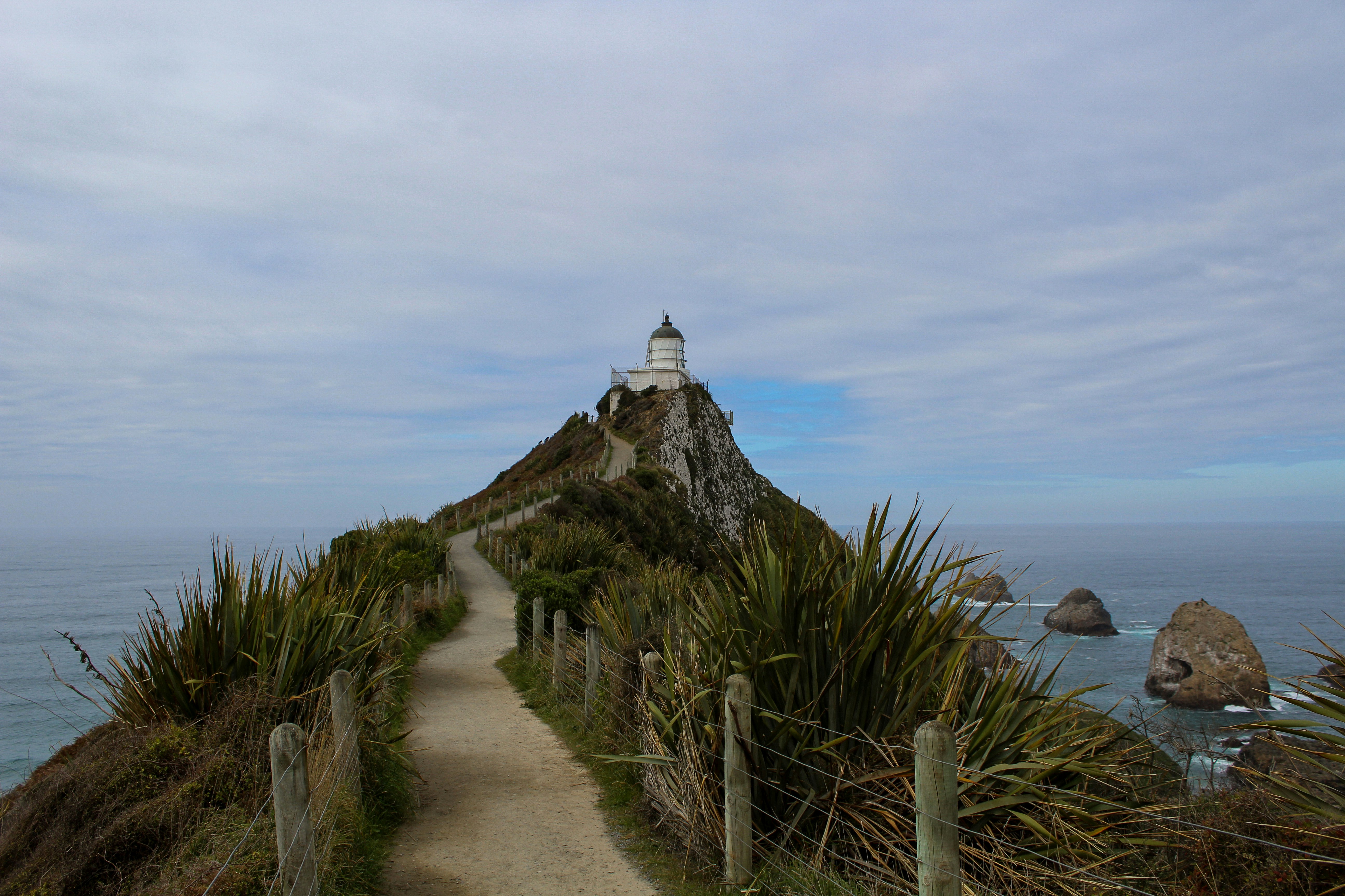 White lighthouse on hill photo – Free Nugget point lighthouse the ...