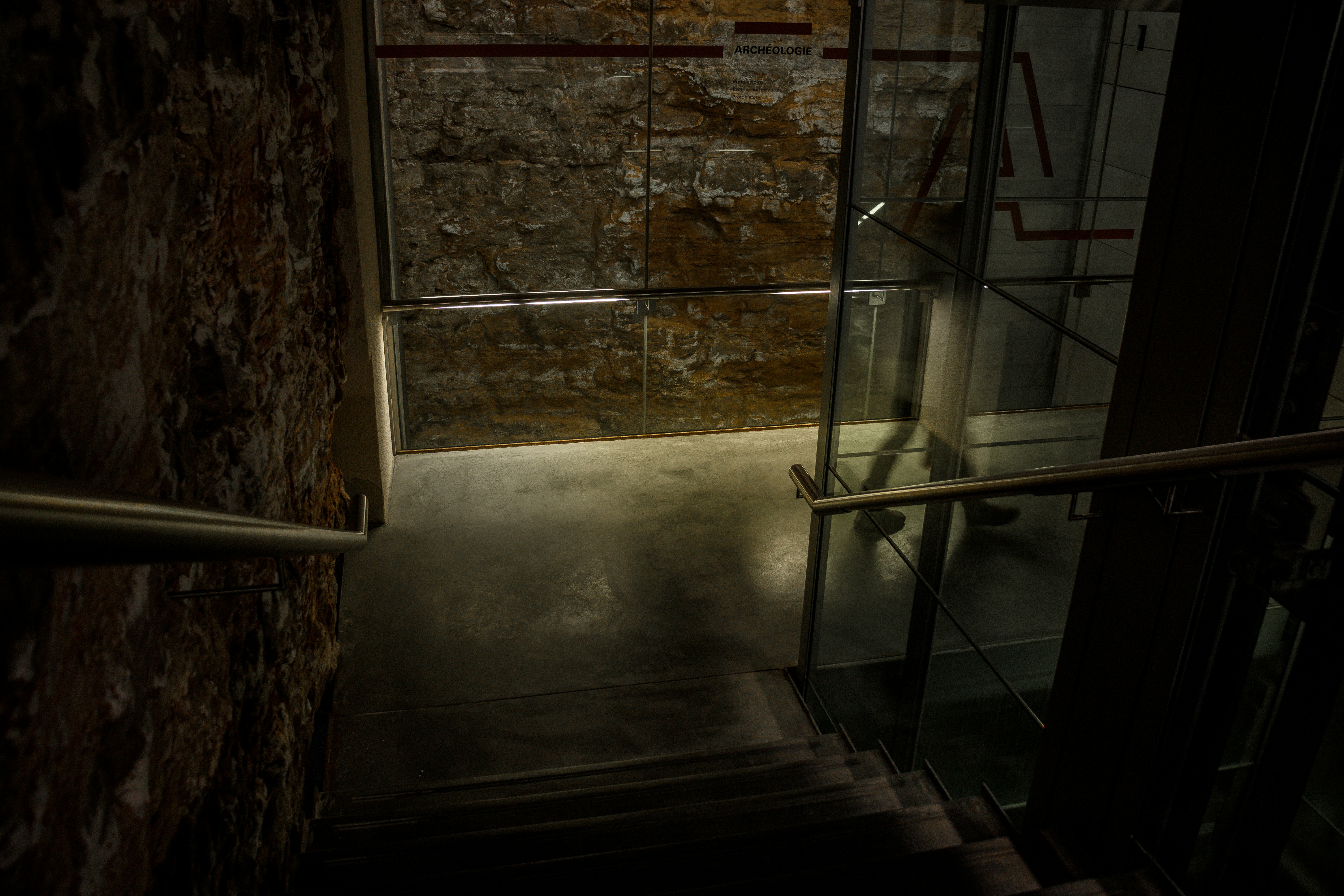 A dimly lit room with a glass door photo – Free Grey Image on Unsplash