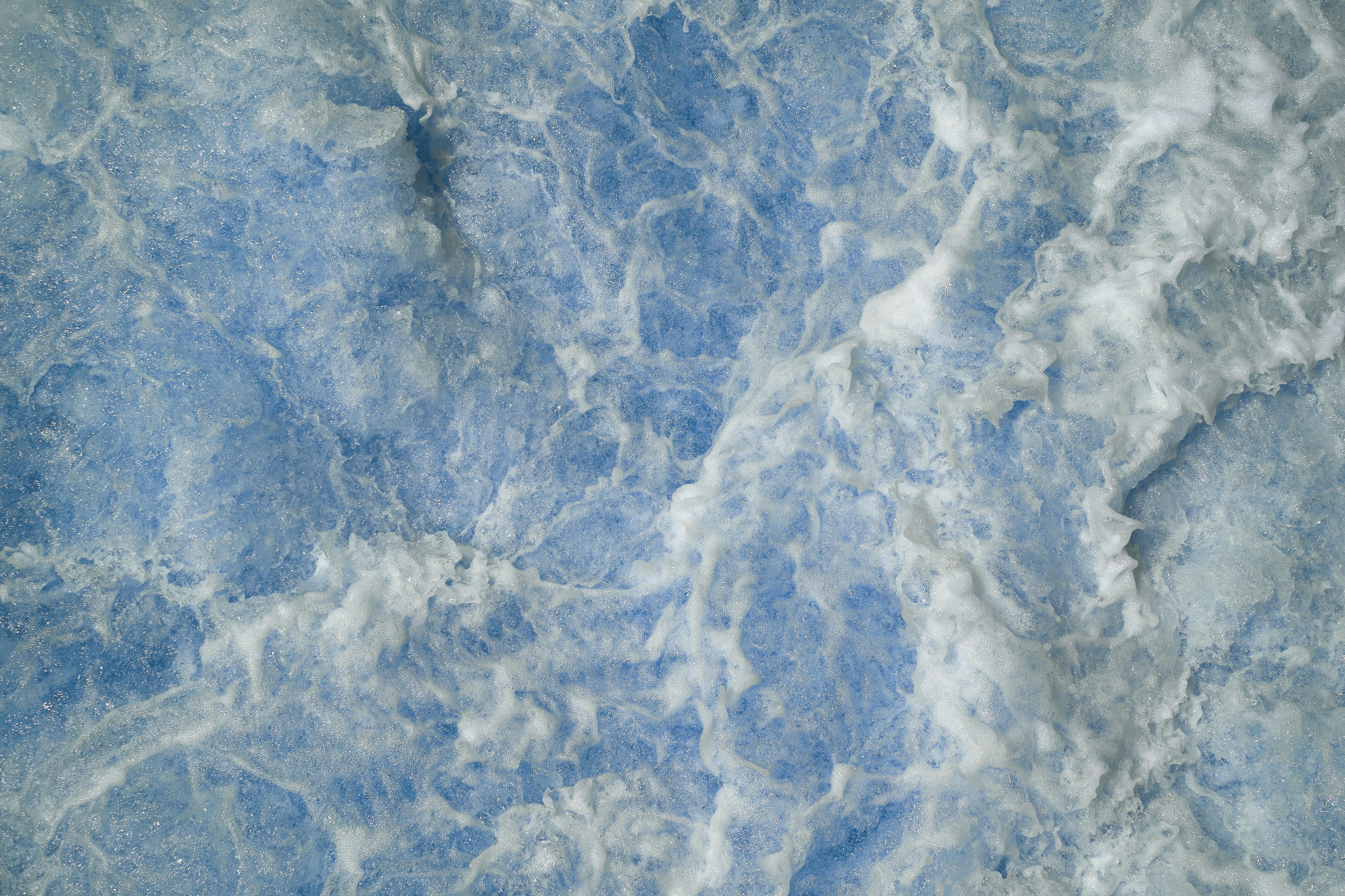 Blue Ice Veins: A Close-Up of Fractured Glacier Texture