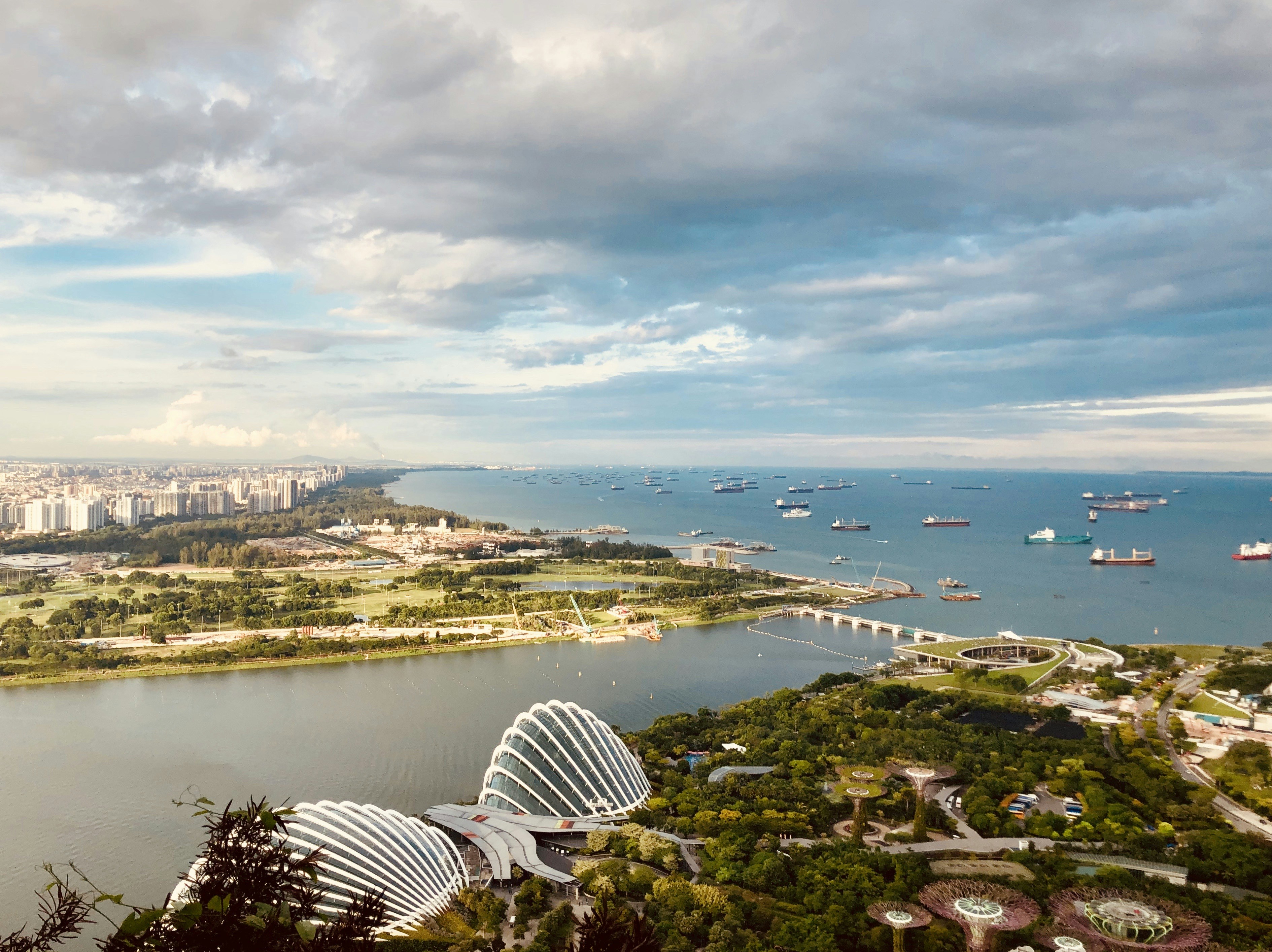 Overhead Harmony: White Canopies Over Marina Bay's Fleet