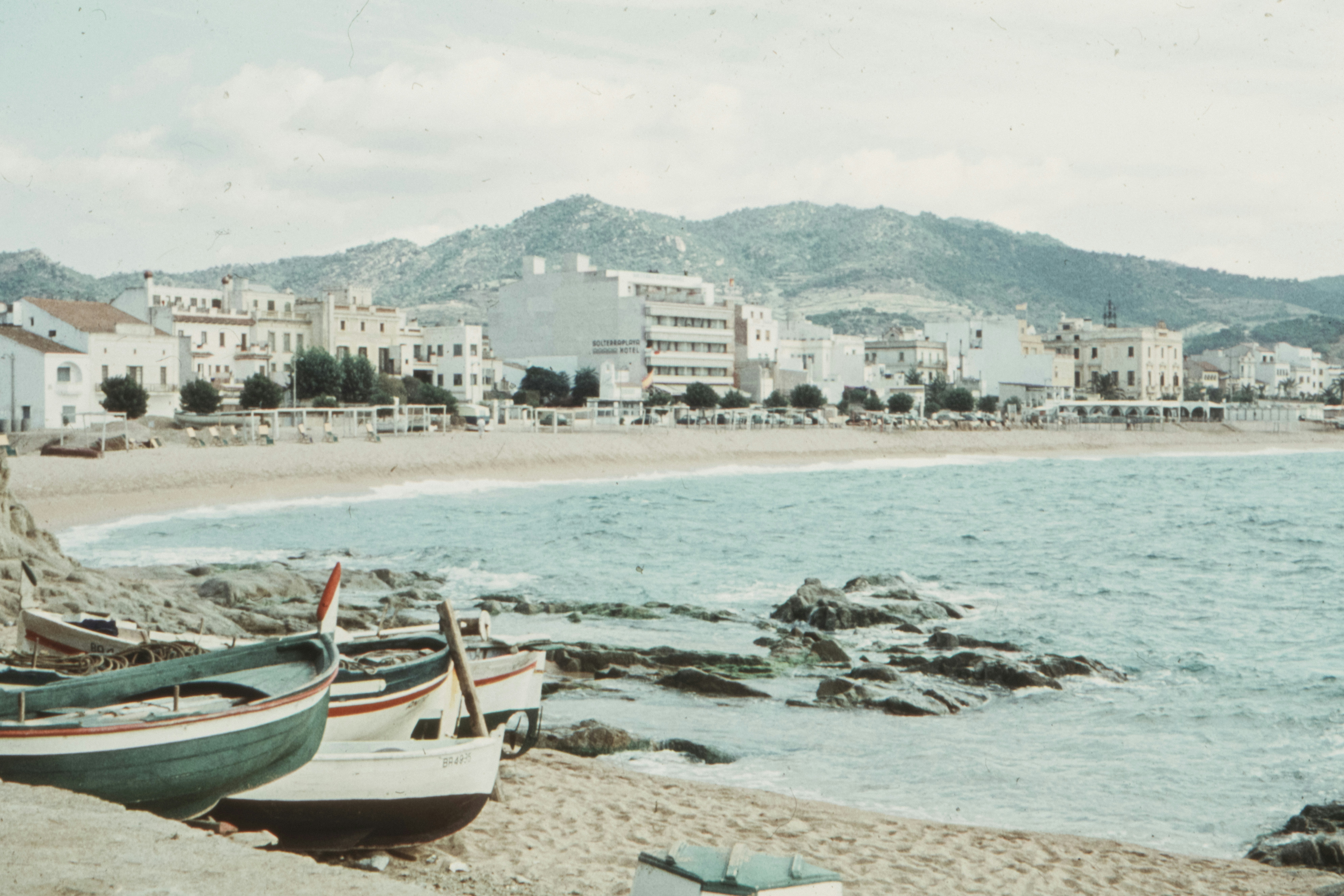 Lloret de Mar, Costa Brava, Spain - August 1958 | buildings on island during day