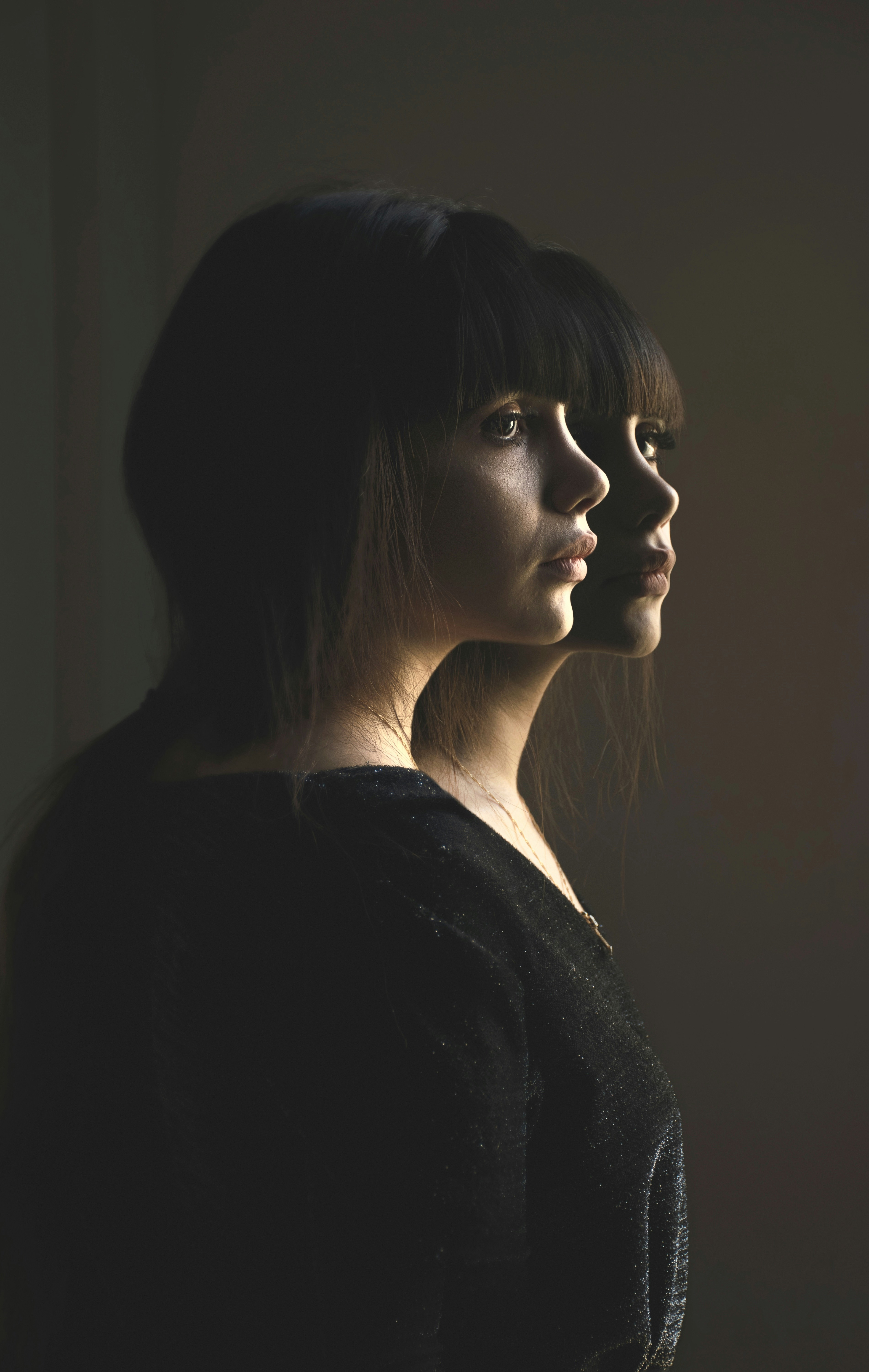 Echoes in Light: A Double-Profile Portrait in Quiet Warmth