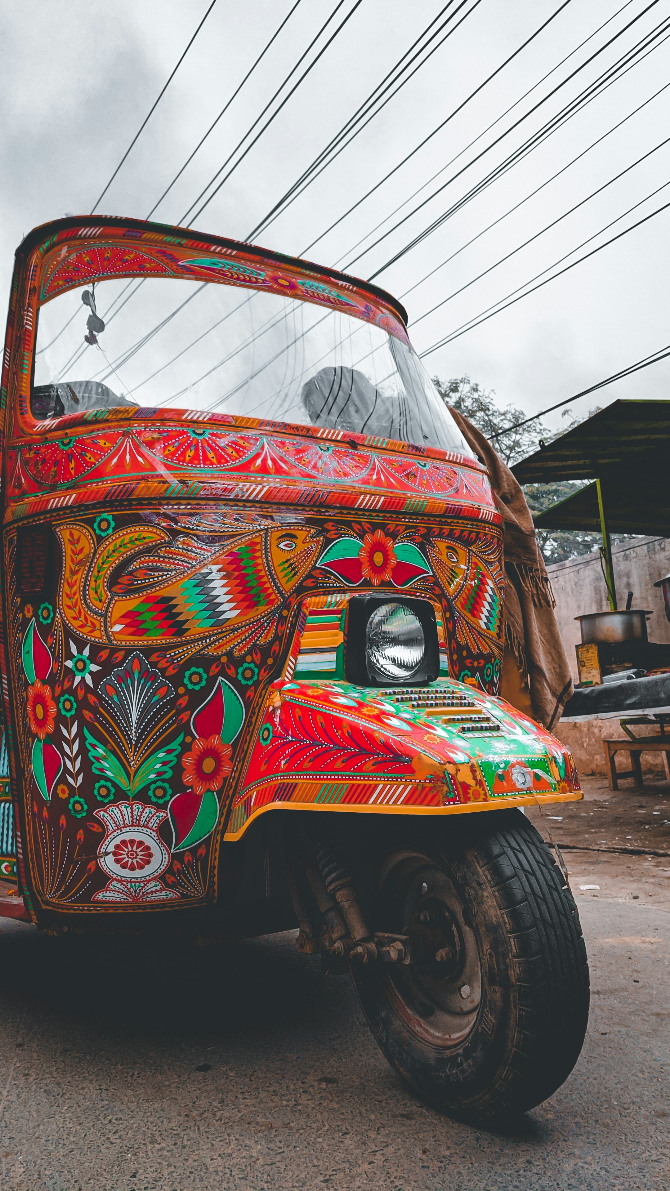 Colorful Trance: A Vibrant Tuk-Tuk Standing Proud