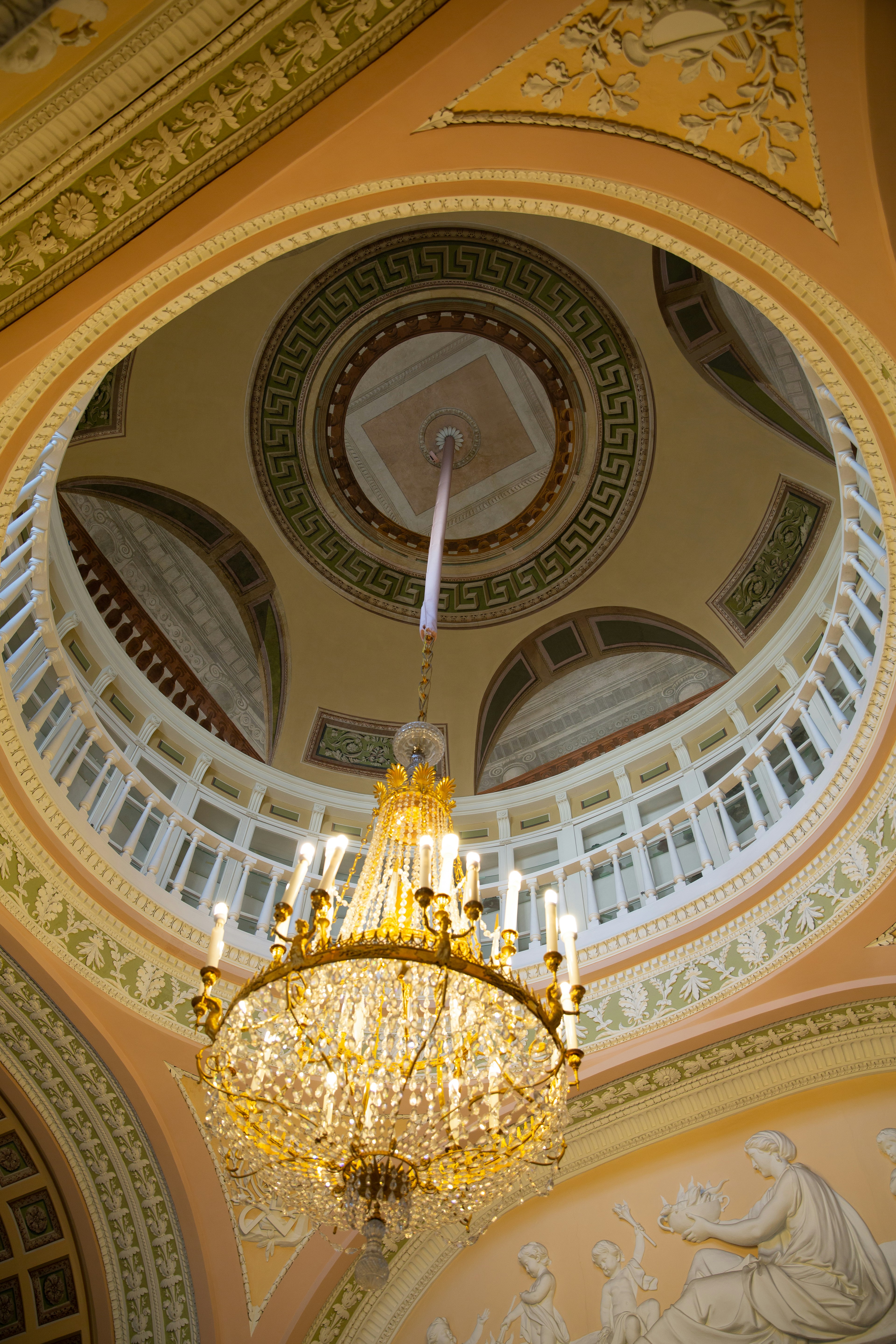 Halo of Gold: A Chandelier Anchored in a Painted Rotunda
