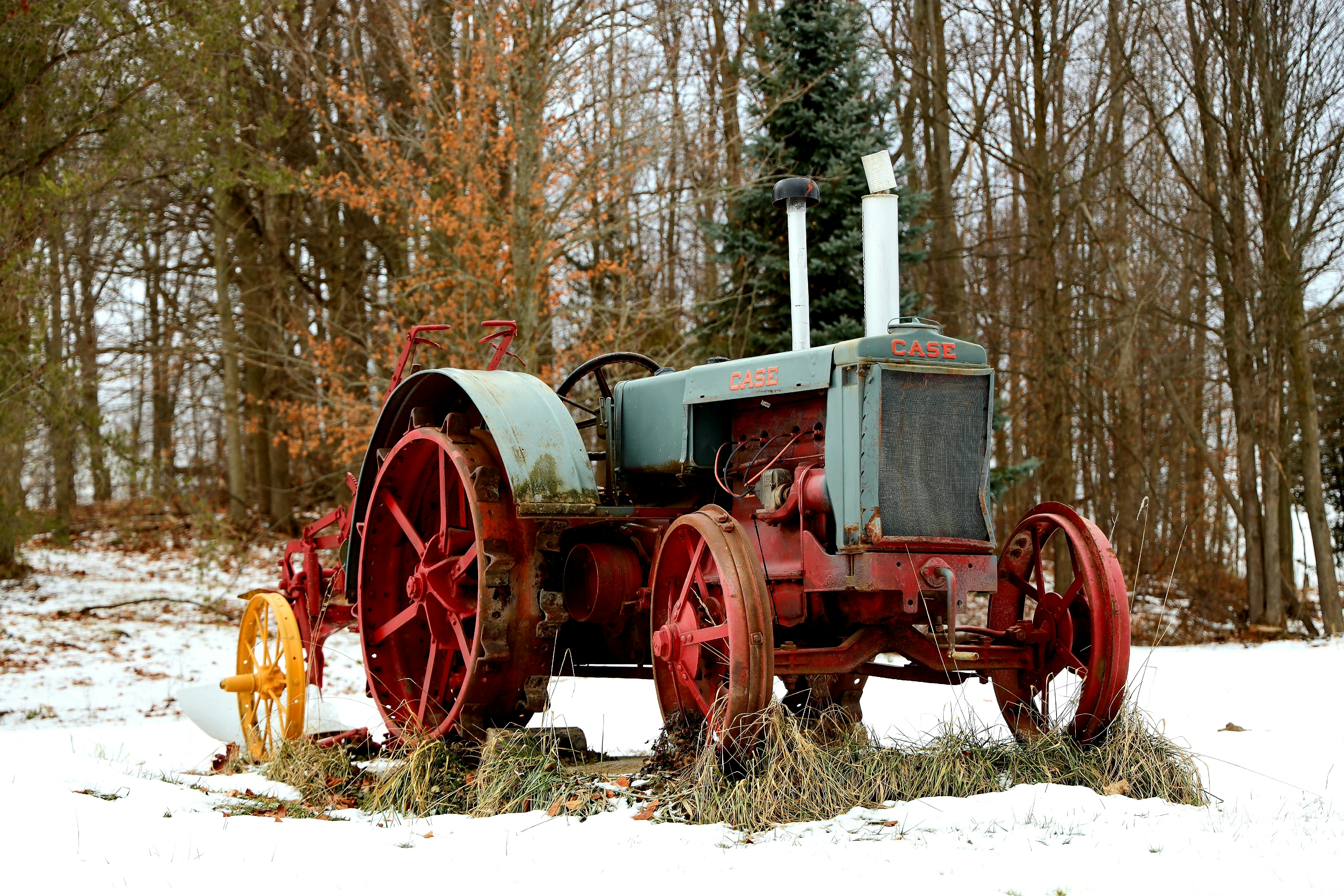 Classic gray and red tractor on snow field during daytime photo – Free ...