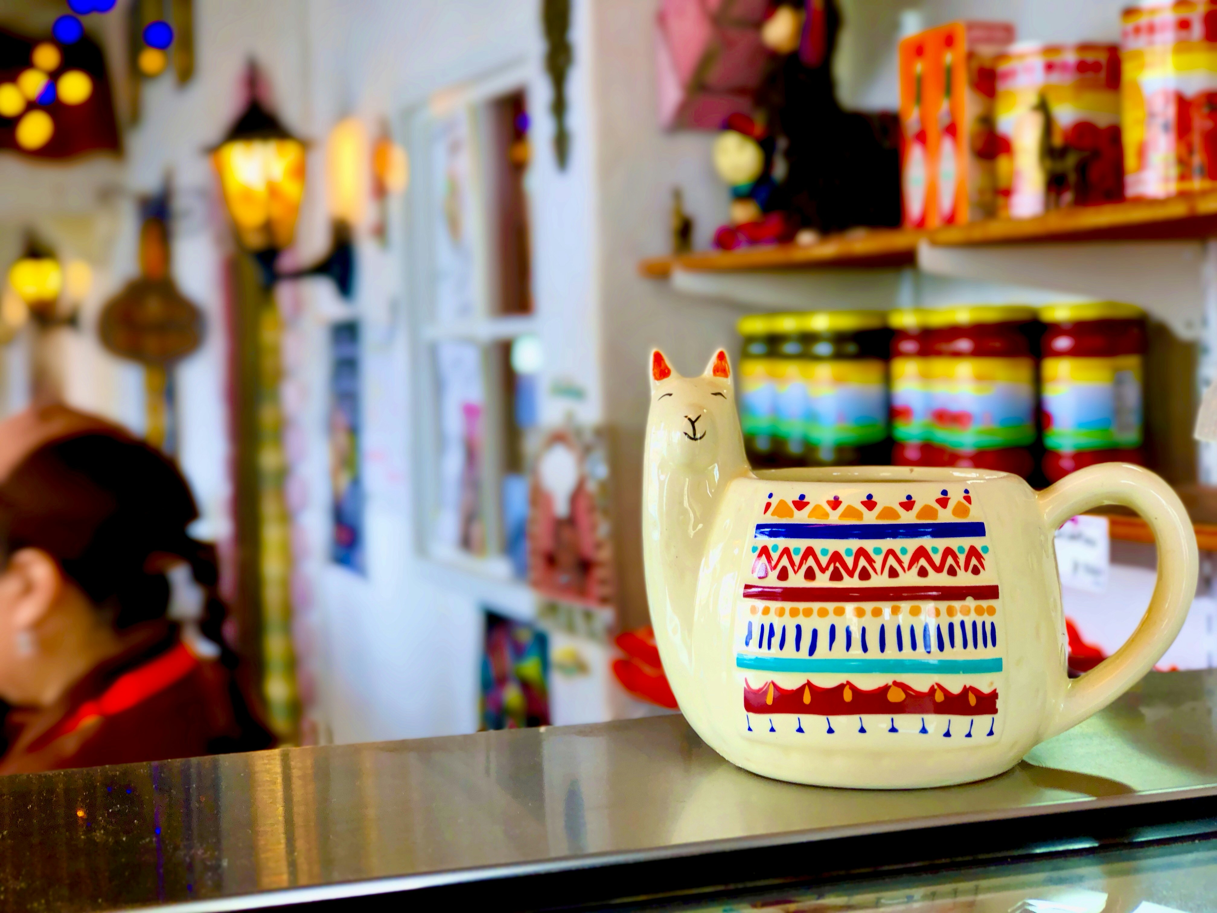 white, red, and blue ceramic mug