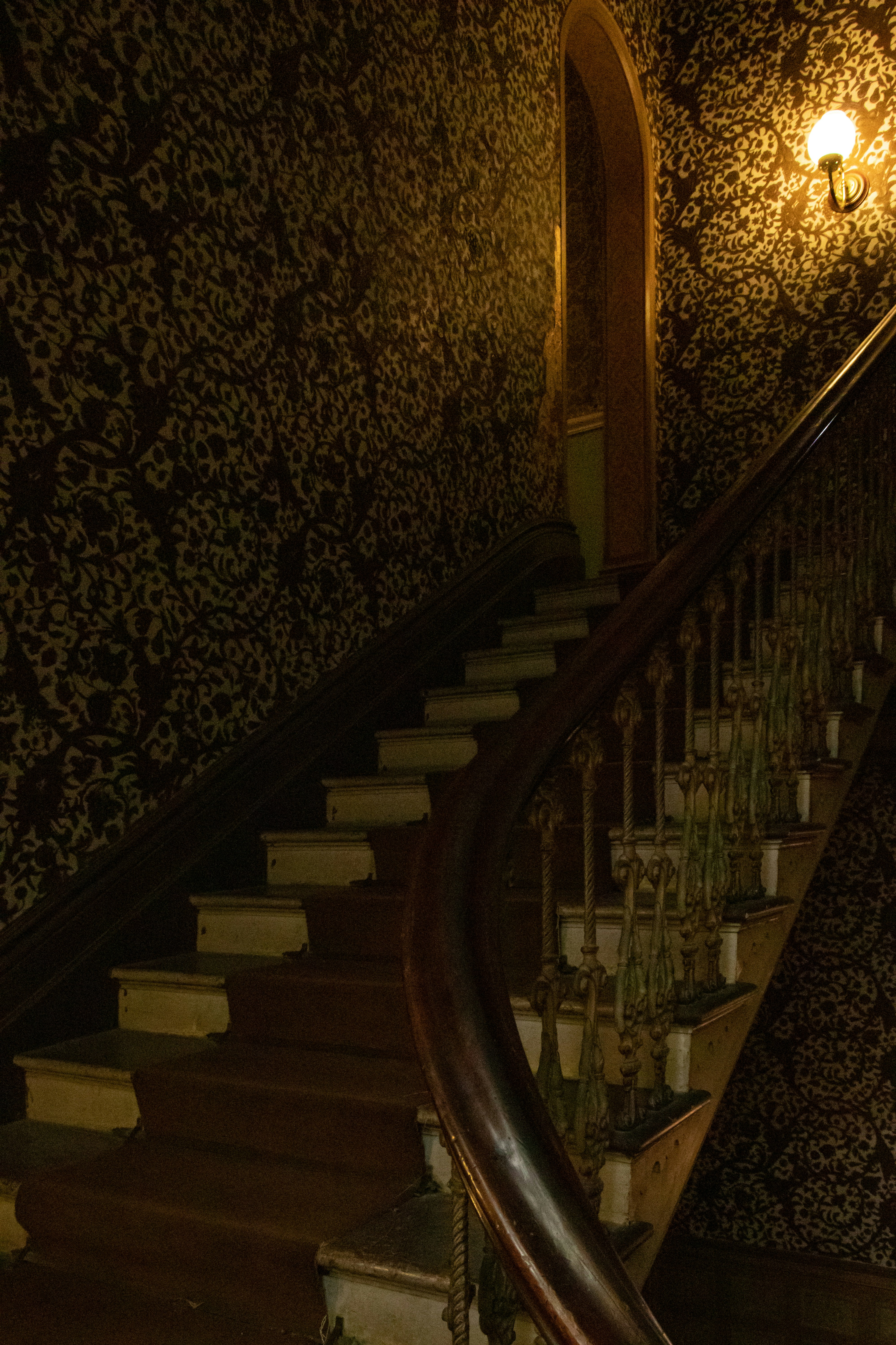 Lamplit Velvet Staircase in an Old Manor