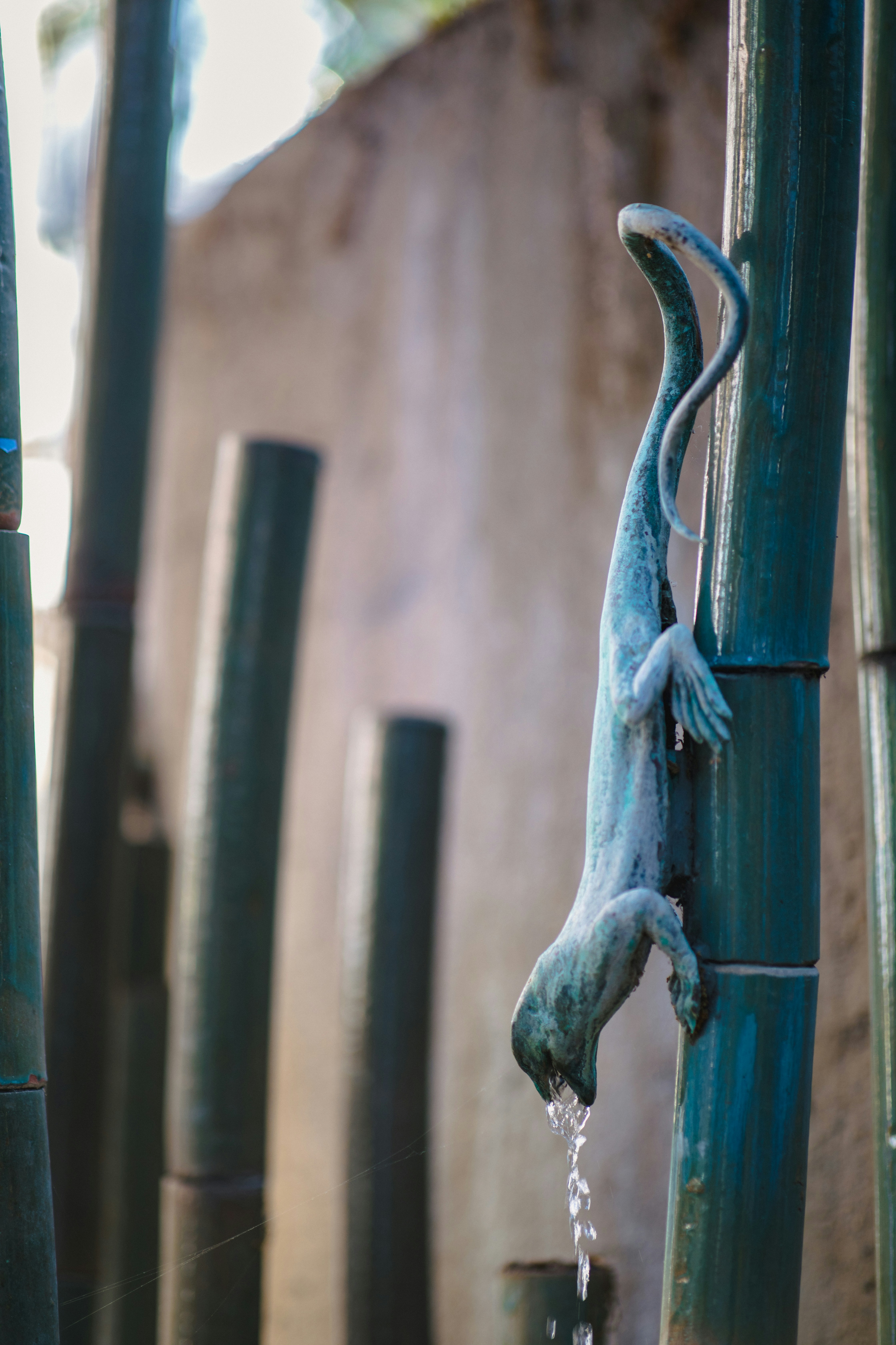 Dripping Blue Flamingo on a Cyan Bamboo Spire