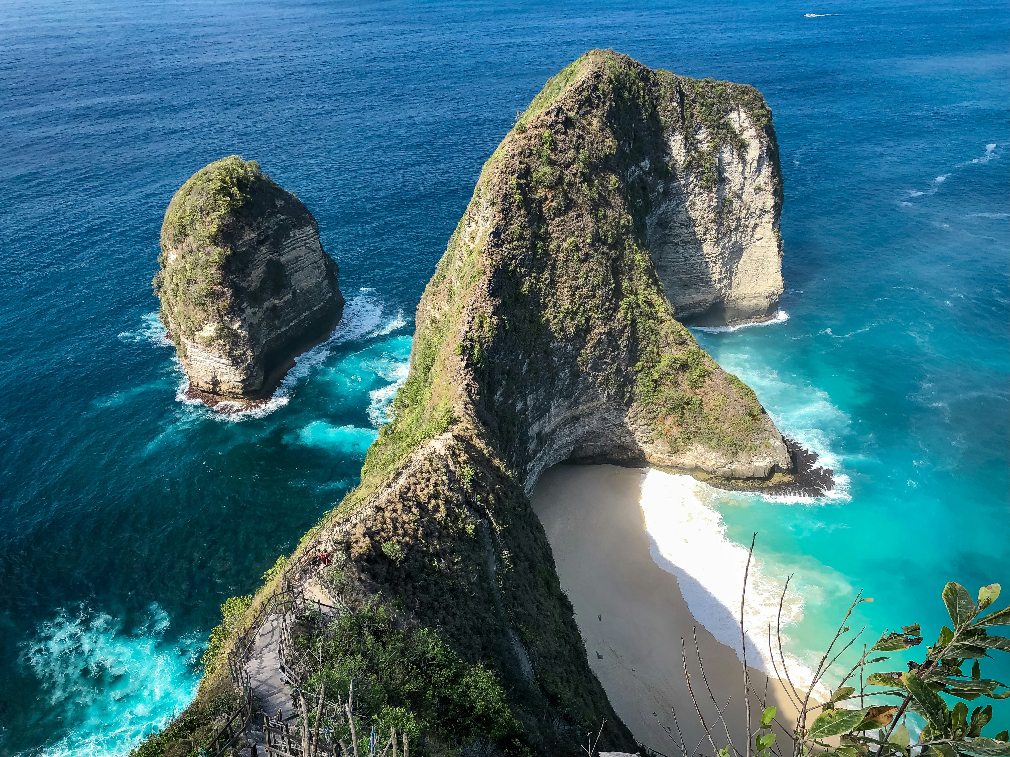 Gray rock formation near seashore photo – Free Bali Image on Unsplash