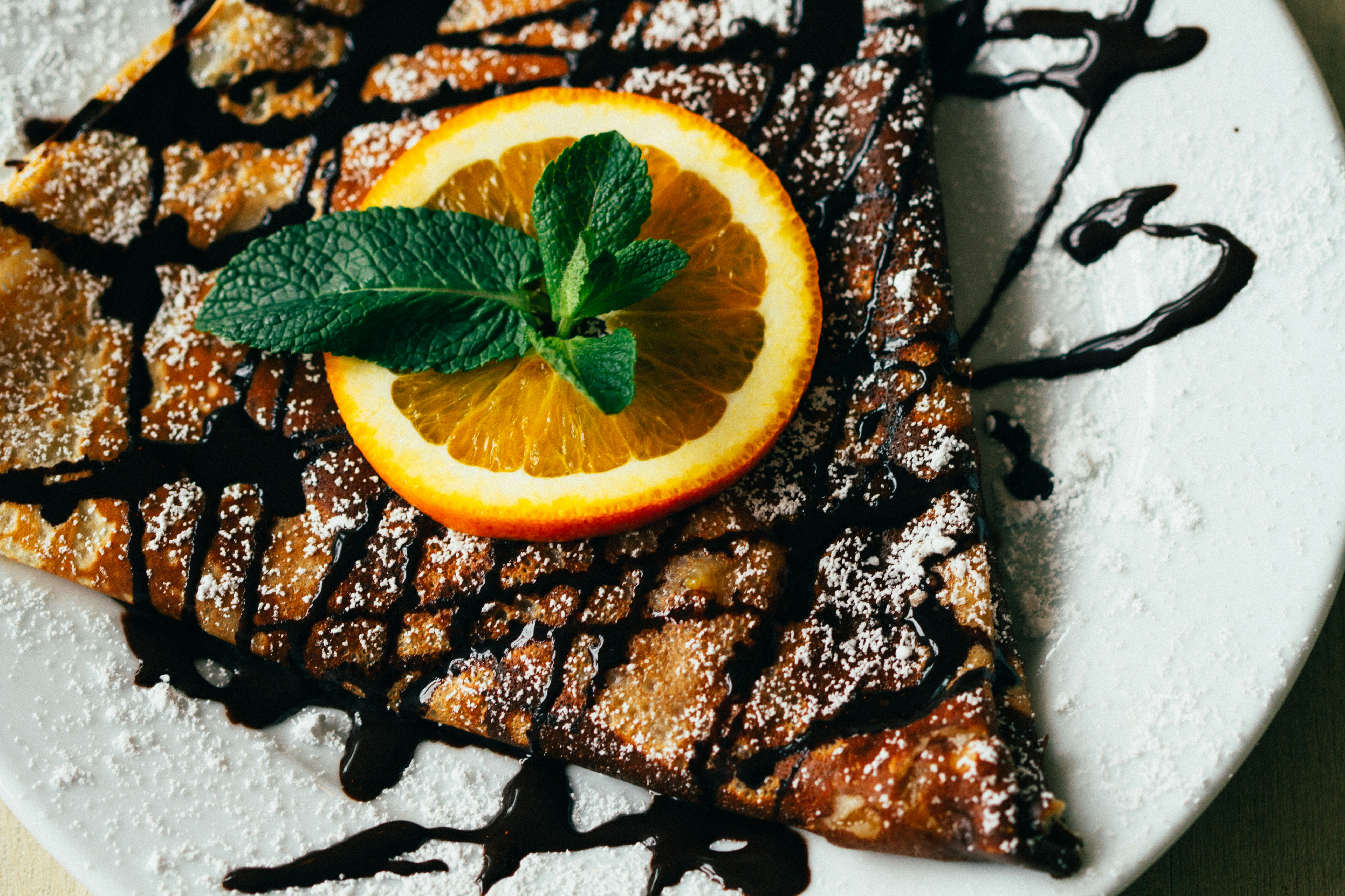 Citrus Crown on a Griddled Crepe: Mint, Chocolate Drizzle and Powdered Sugar