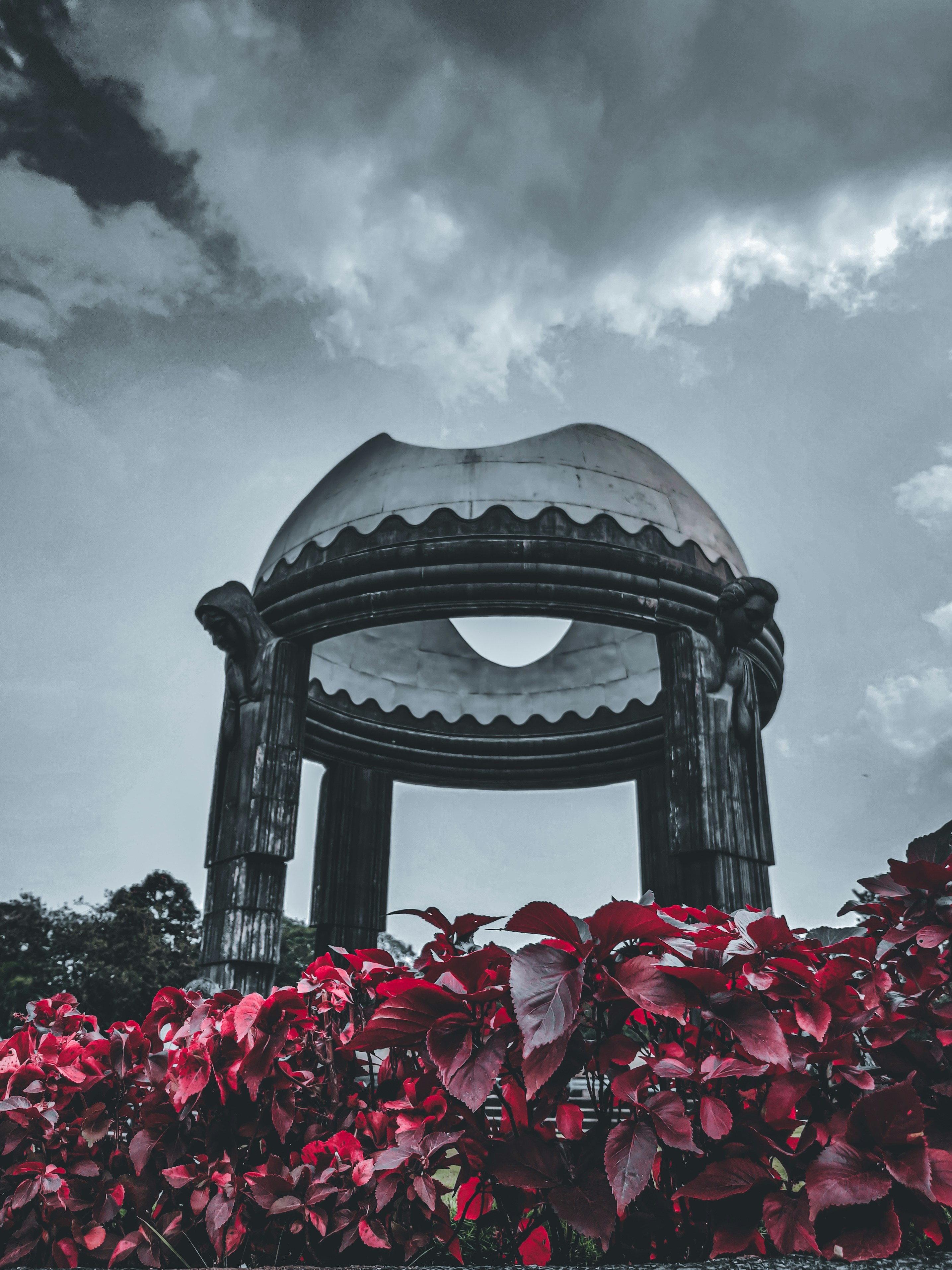 Red-tinted Hinge of Time: A Monument Above the Crimson Foliage