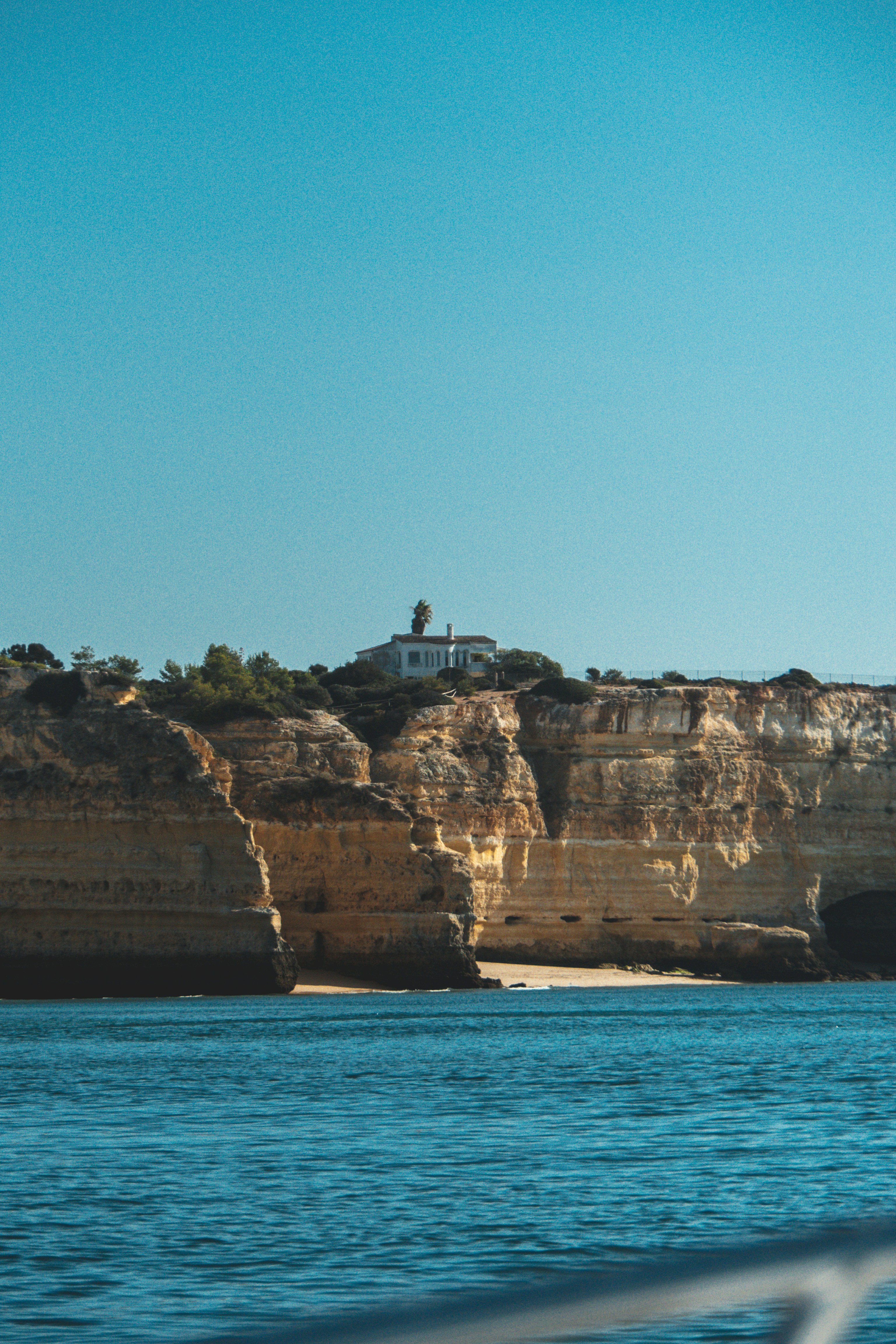 Cliff-top Haven Over a Turquoise Sea