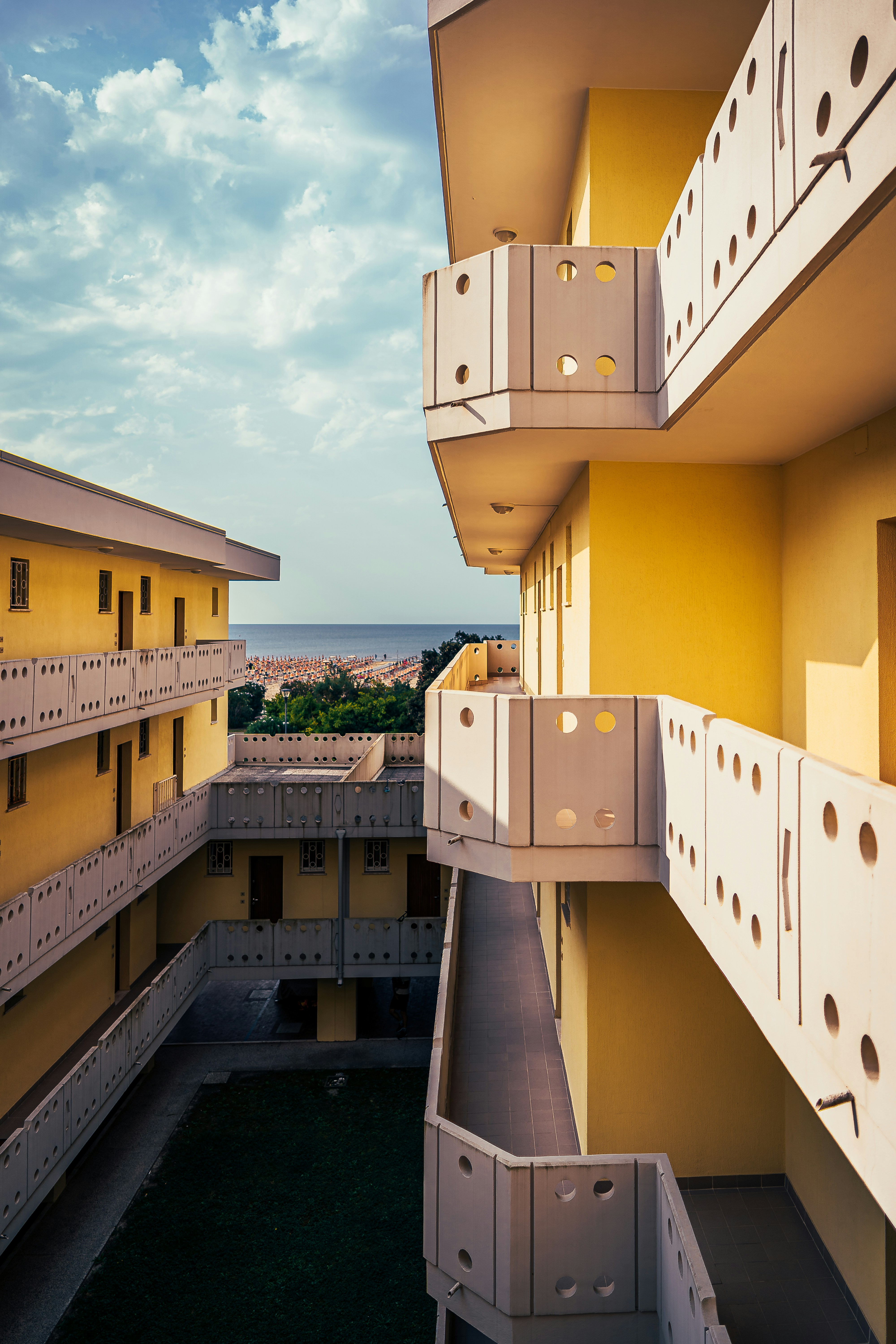 yellow and white 4-storey buildings during daytime
