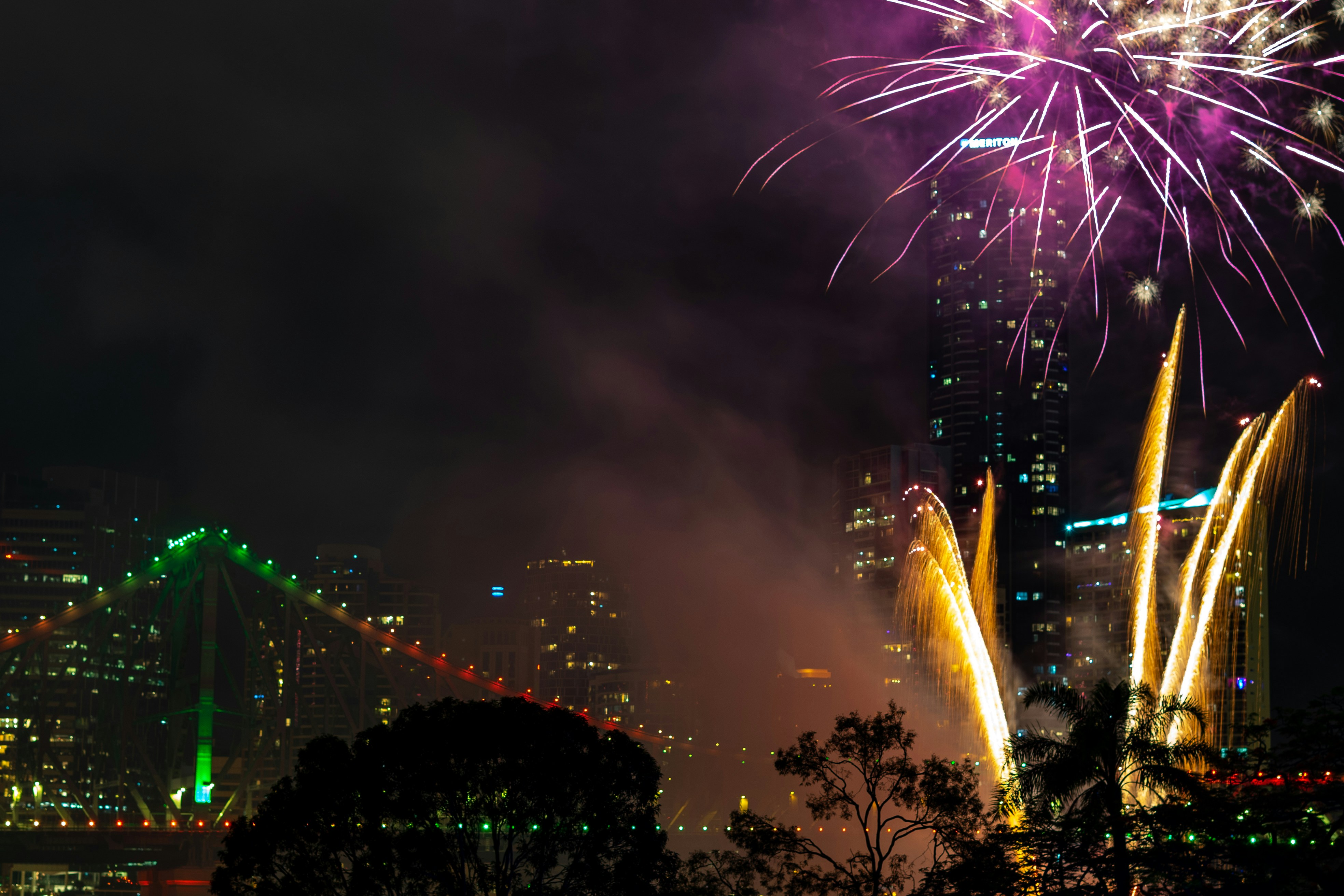 Fireworks near lighted bridge photo – Free Night Image on Unsplash