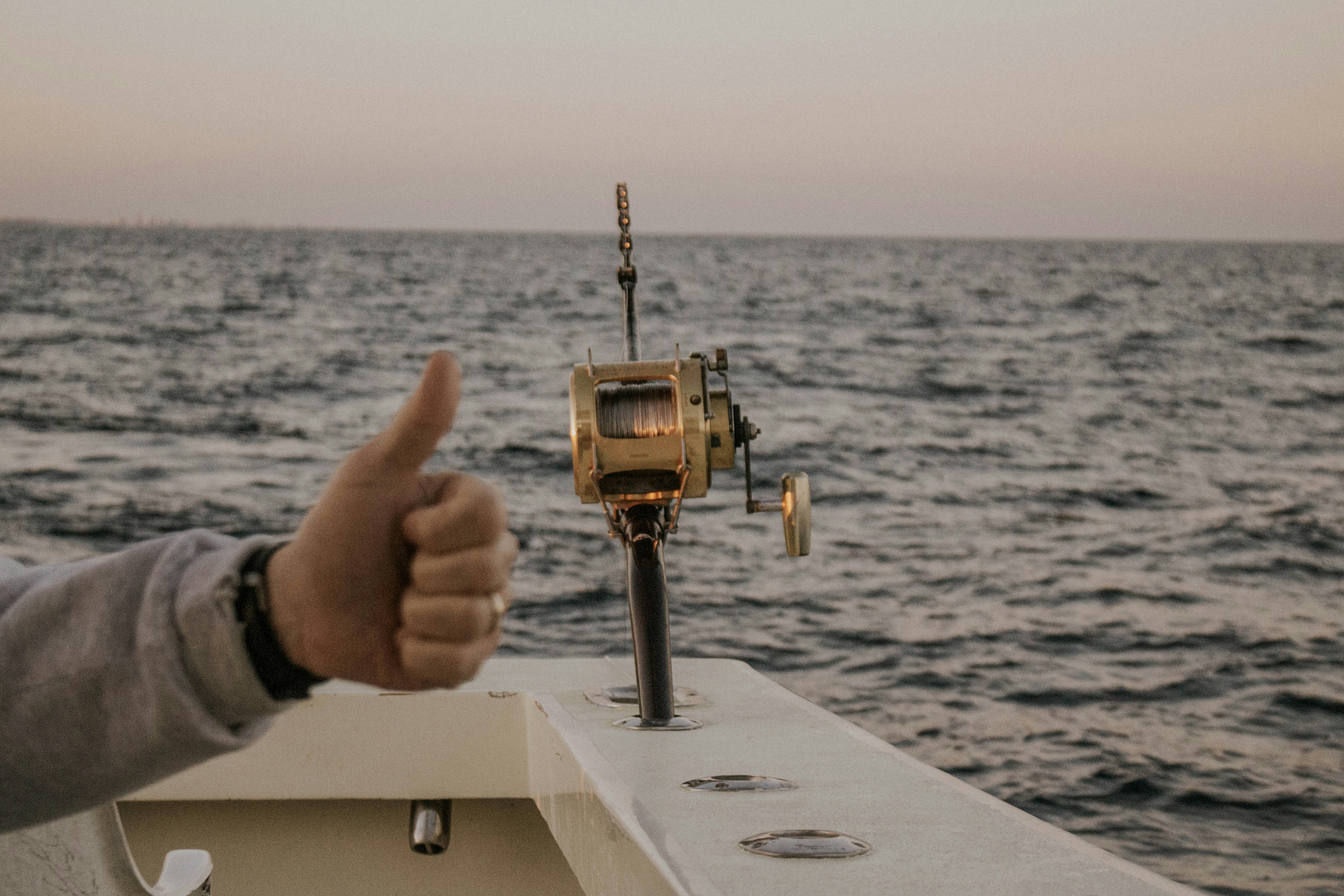 Brown fishing rod photo – Free Human Image on Unsplash