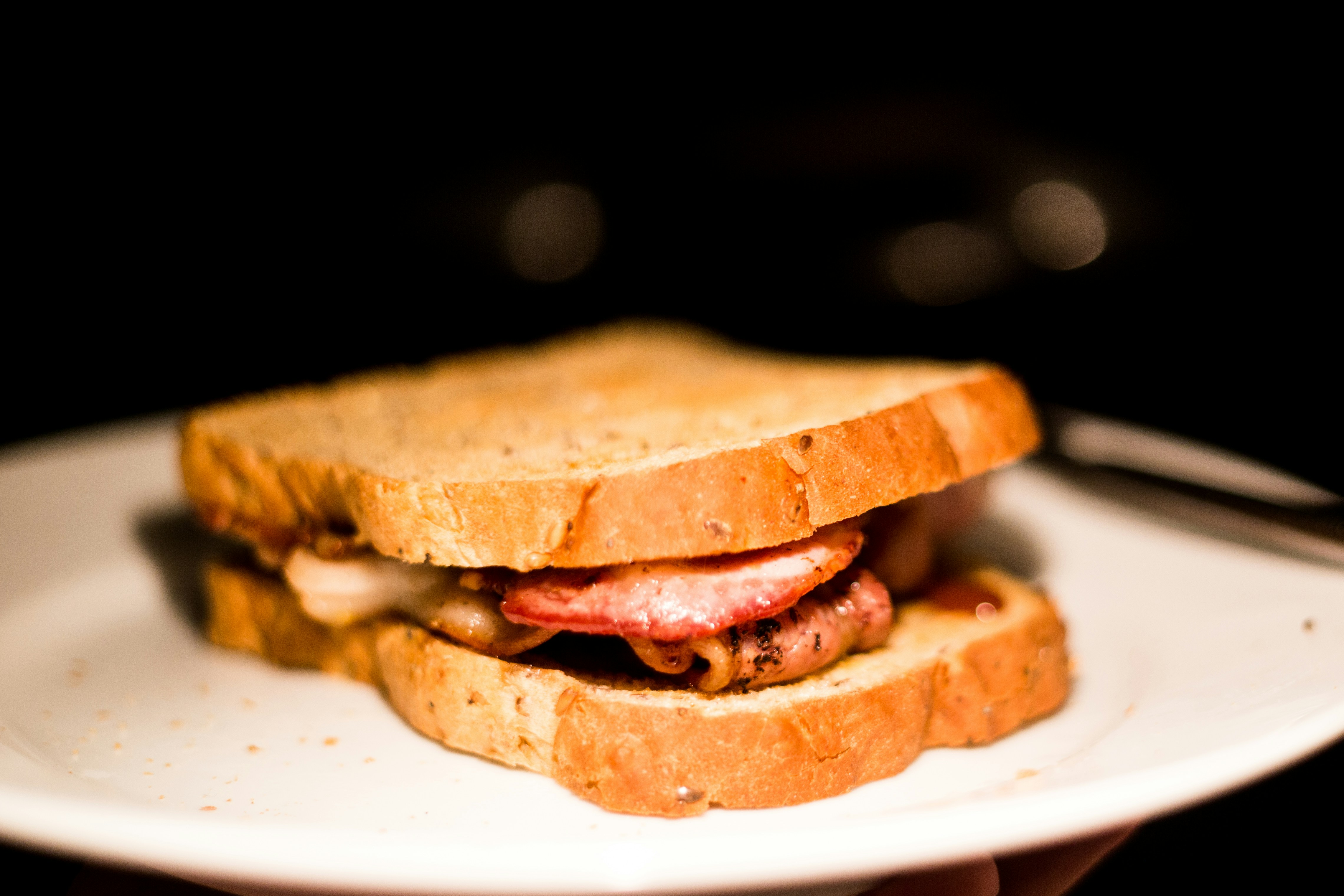 Blurred Crunch: a close-up of a stacked sandwich on a plate