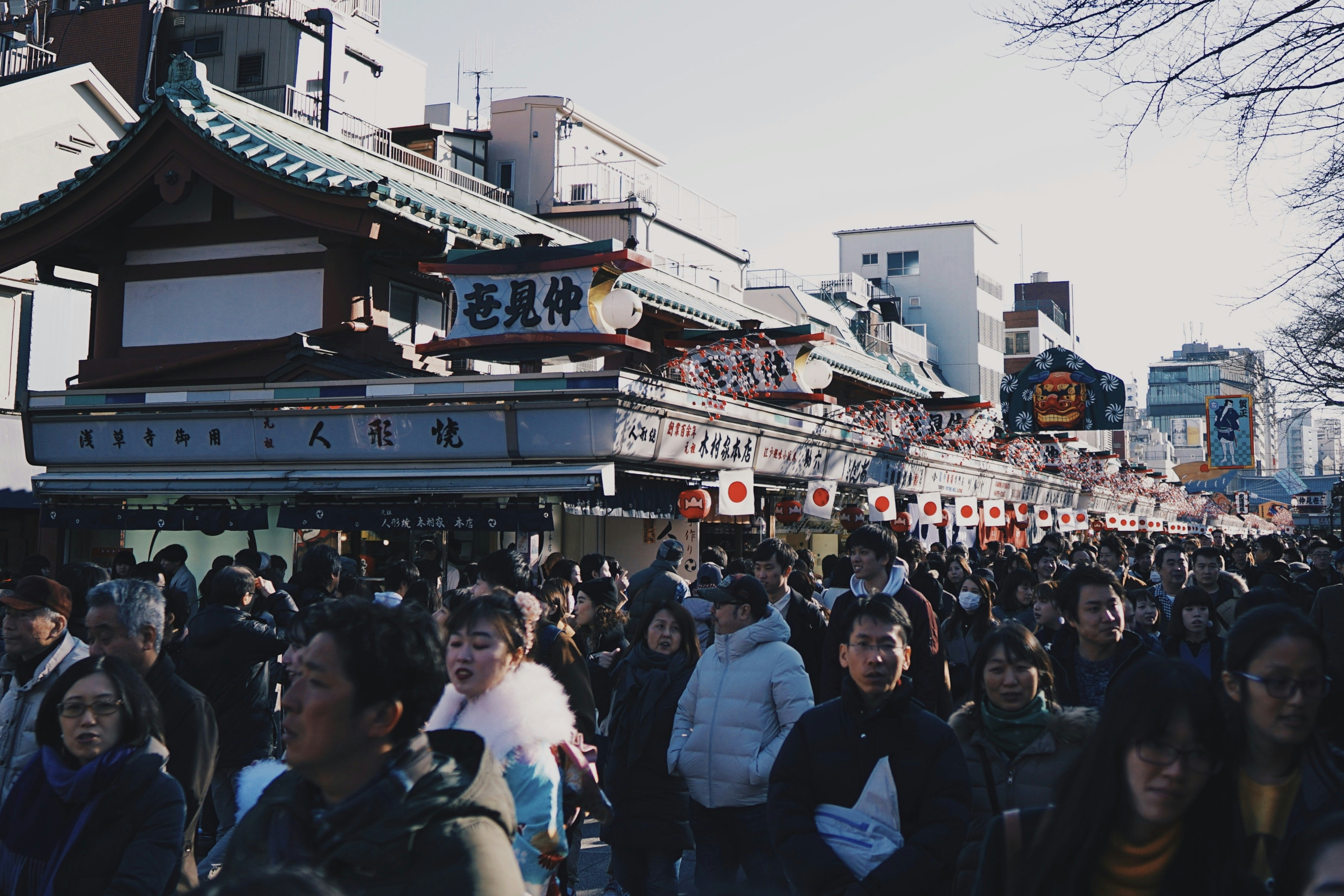 Lantern-Lined Market Street: A Winter Crowd in Motion