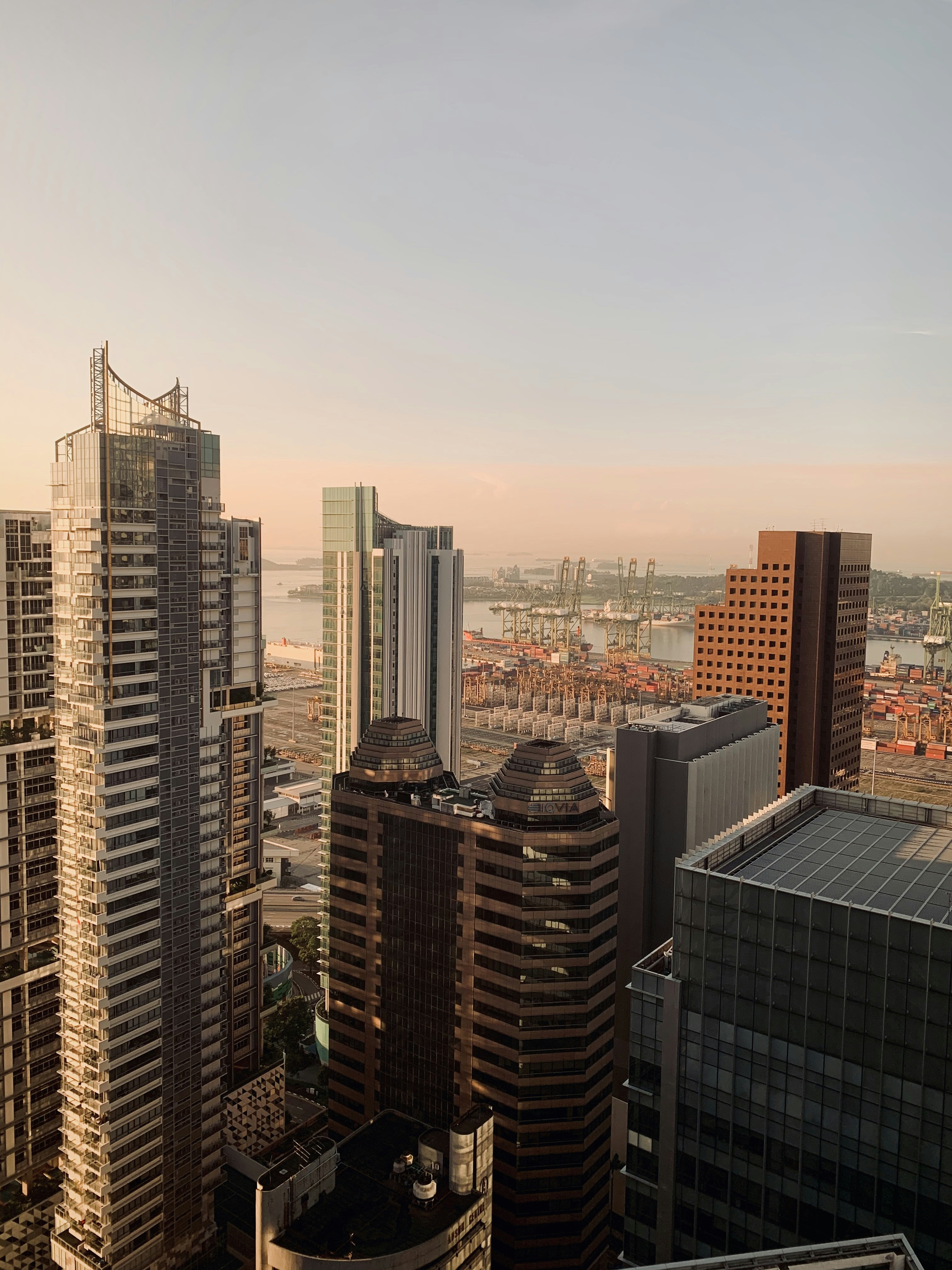 Aerial photography of city with high-rise buildings viewing body of ...