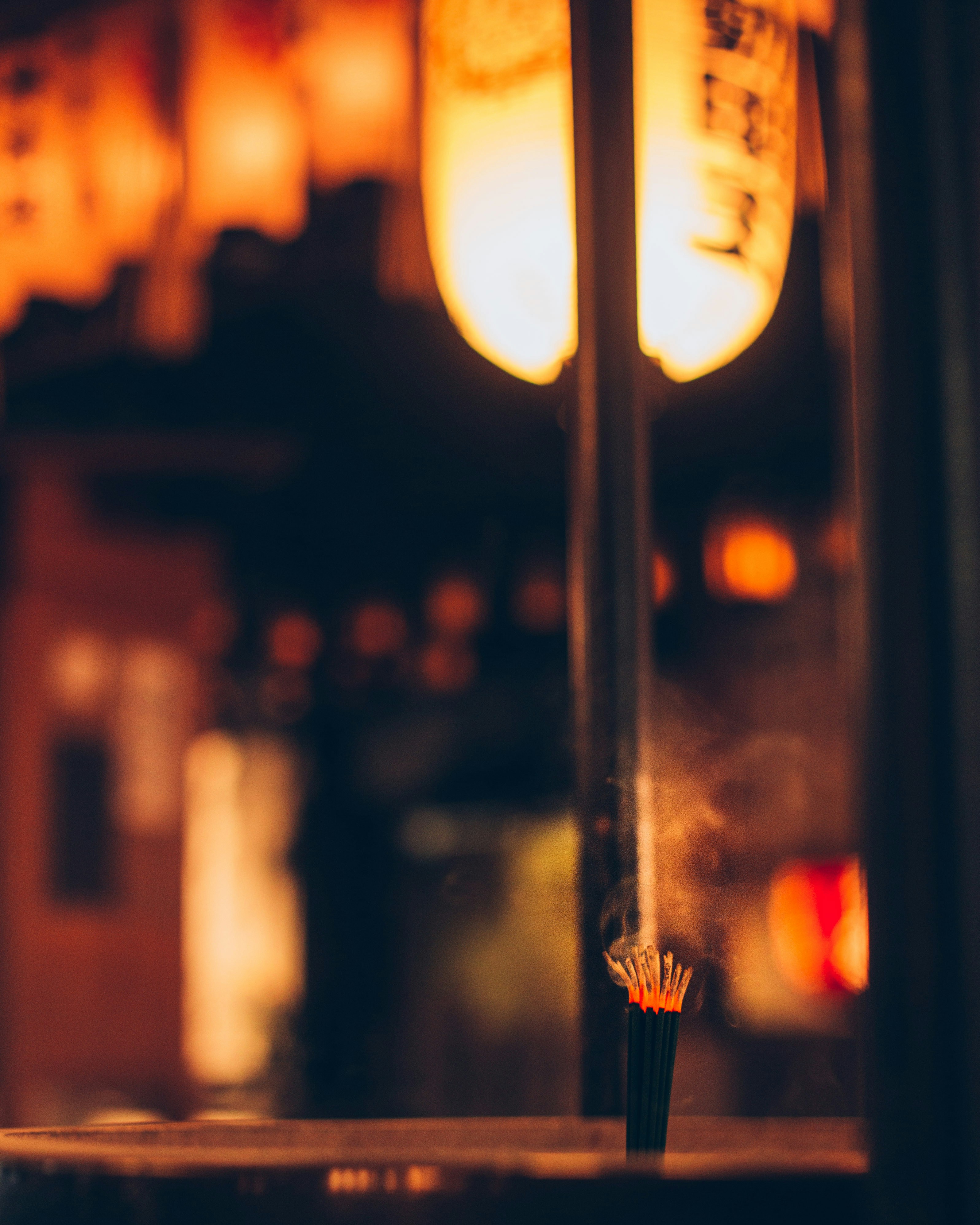 Time-lapse photography of smoke coming from lighted incense sticks ...