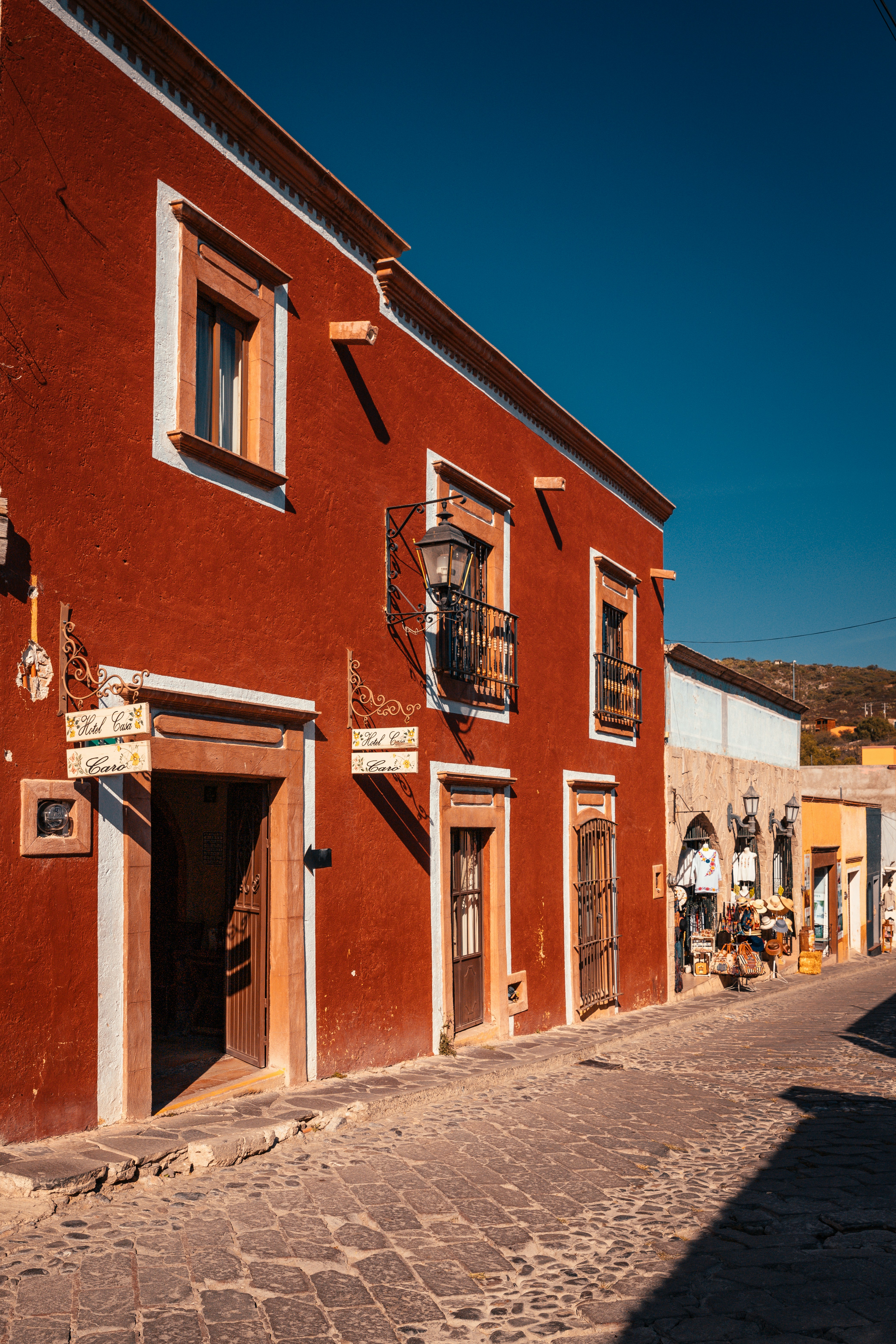 Red concrete 2-story building during daytime photo – Free Walkway Image ...